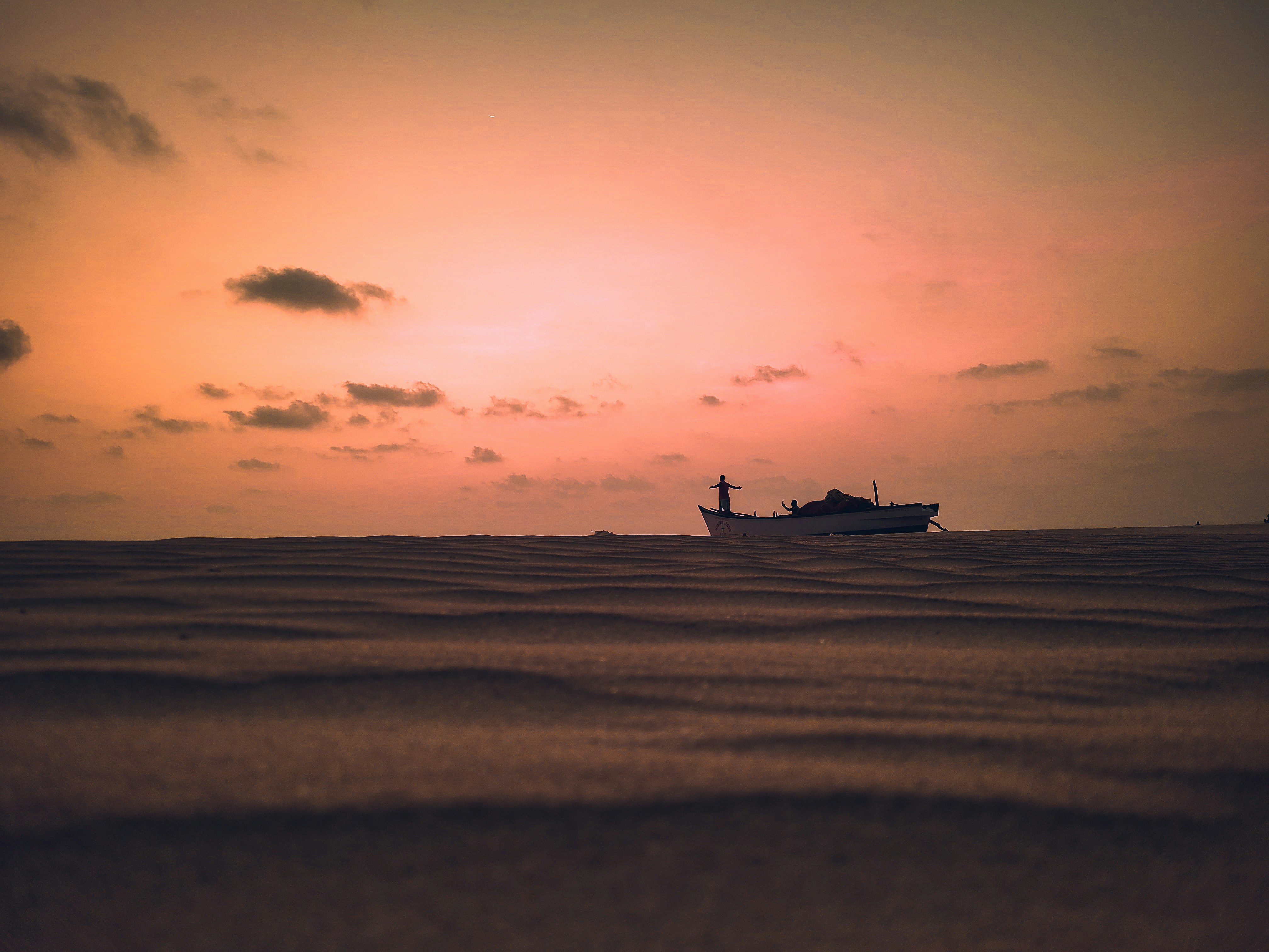 Twilight Silhouette: Boat on the Horizon