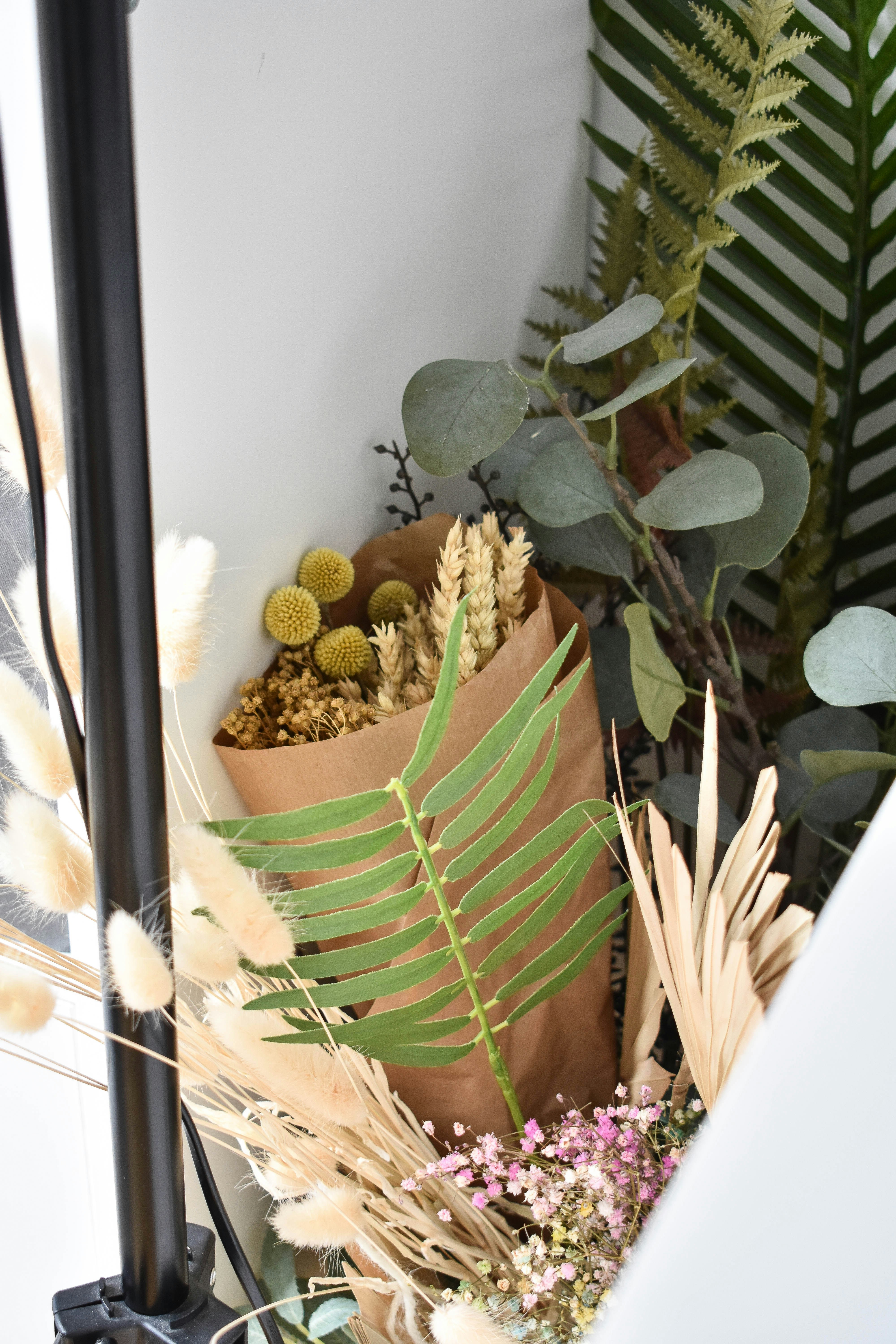 Palm Leaf Amid Dried Blooms in a Quiet Interior Still-Life