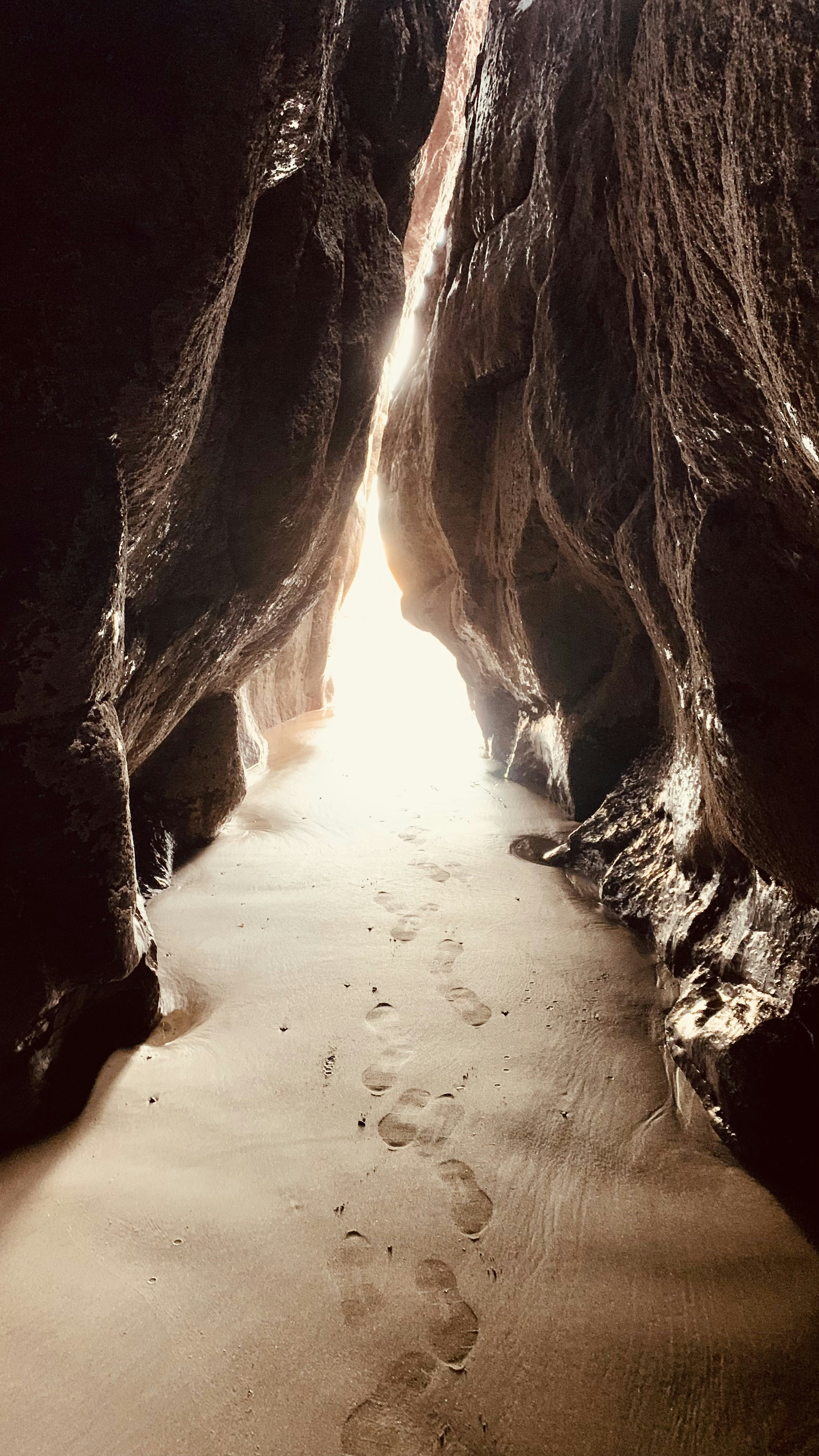 A cave with a river in it photo – Free Freshwater east Image on Unsplash