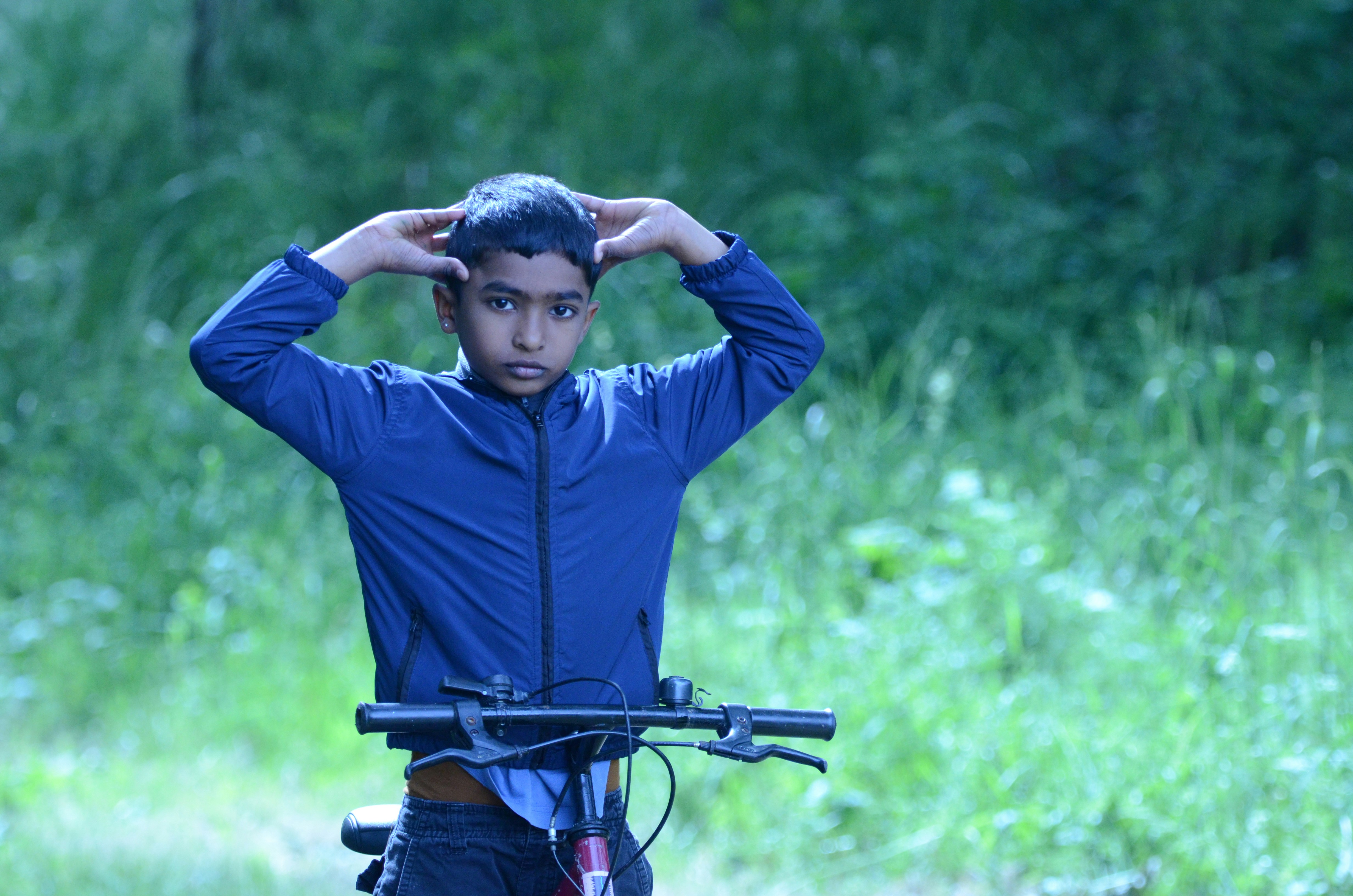 Blue in a Green Clearing: A Quiet Portrait by the Bike