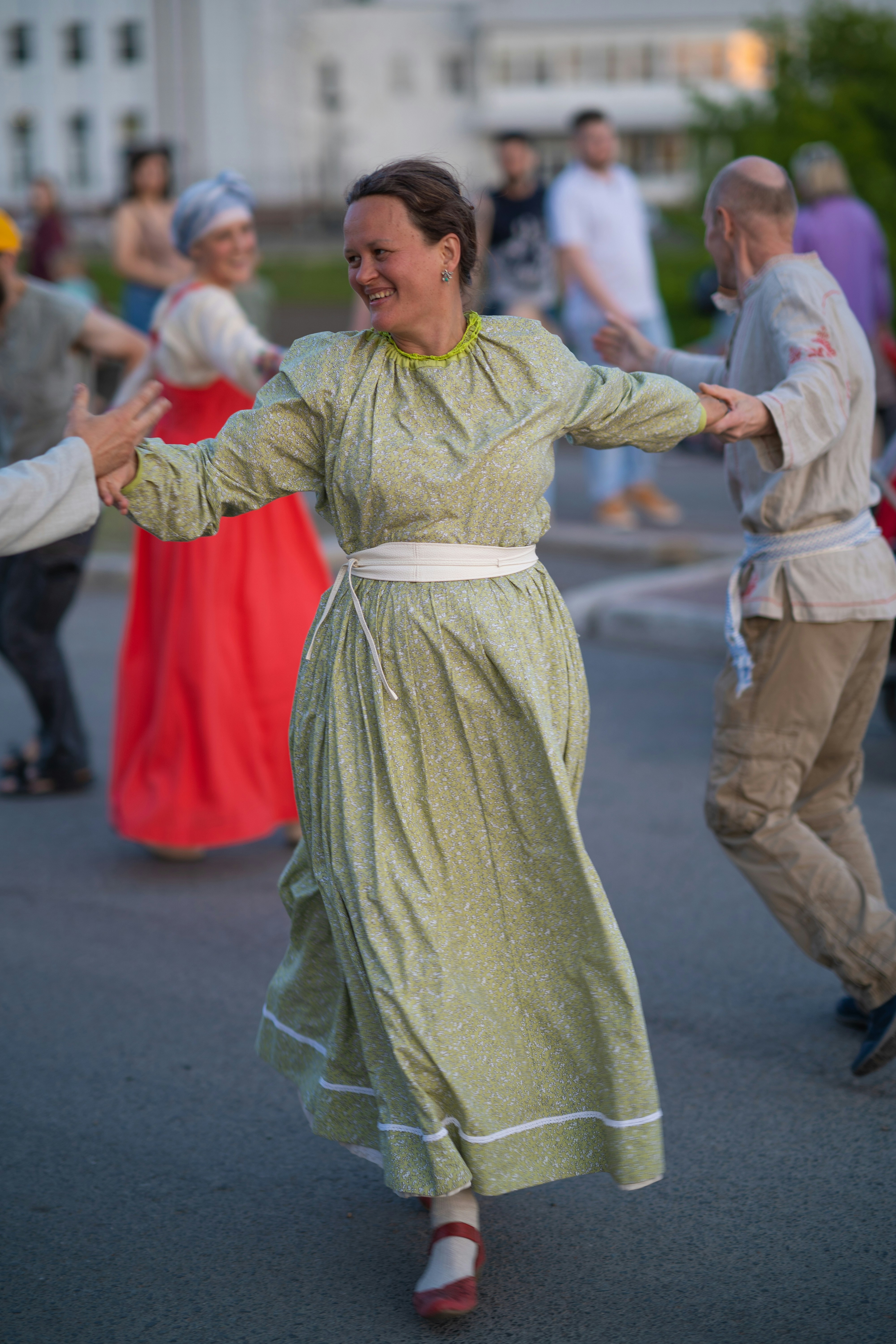 a person in a green dress dancing
