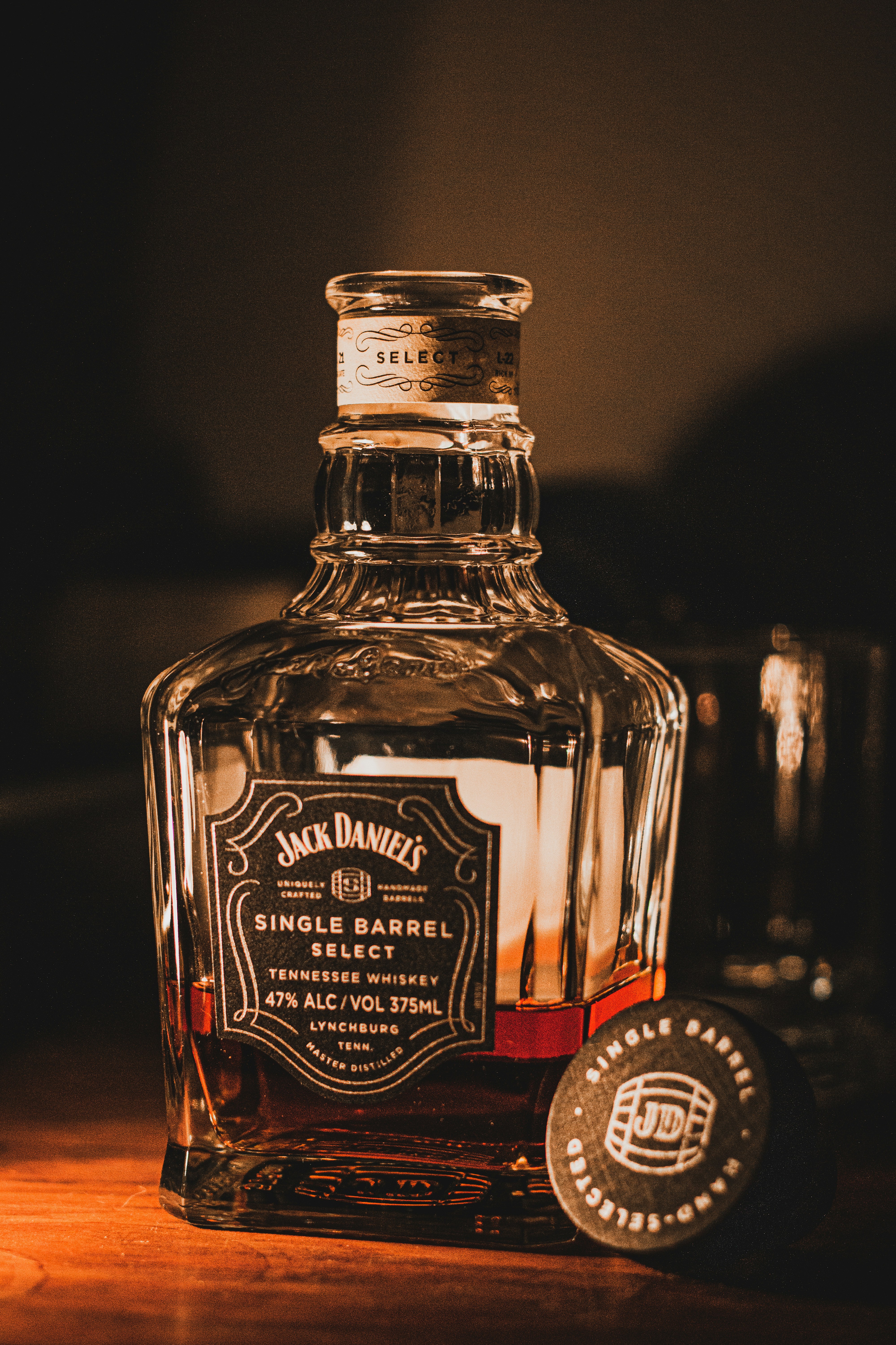 A bottle of alcohol with Jack Daniel's in the background photo – Free ...