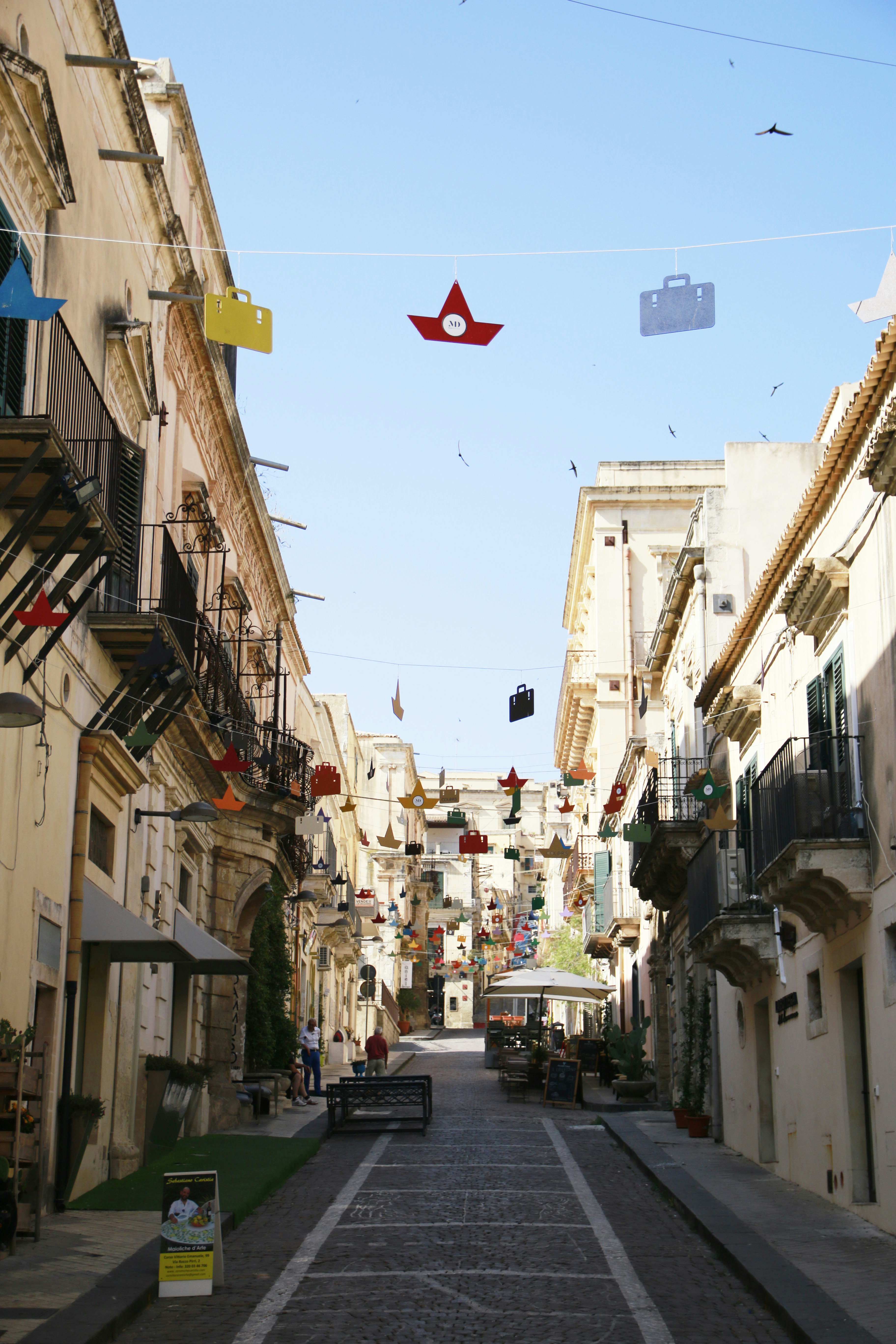 Skyward Stars Over a Cobblestone Street Festival