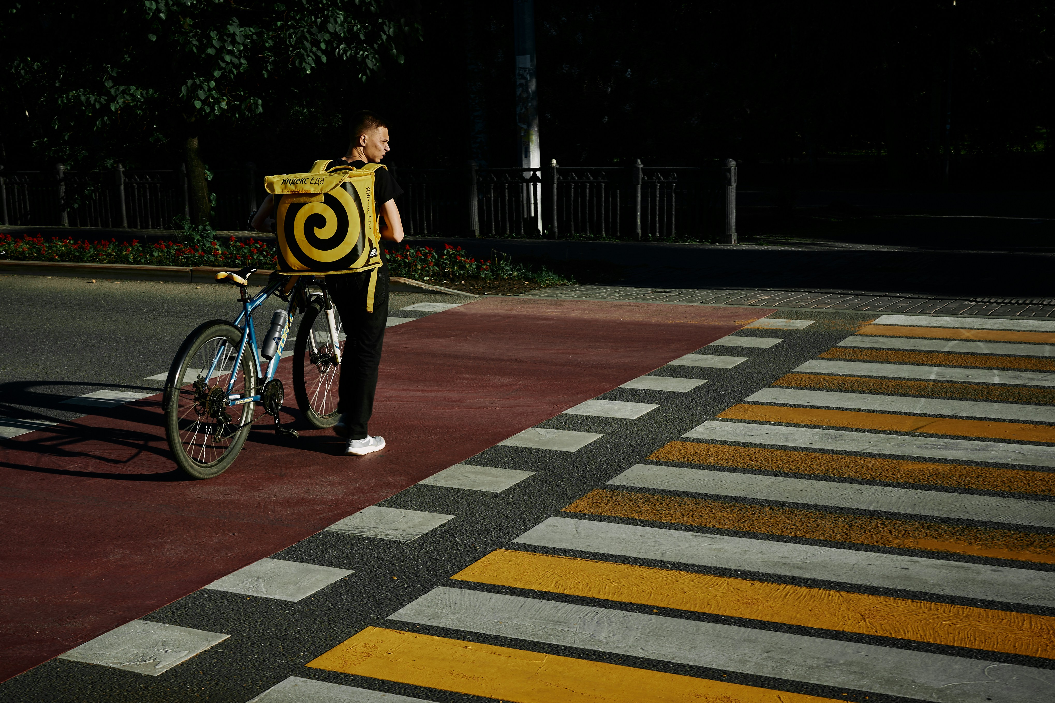 a person standing next to a bicycle