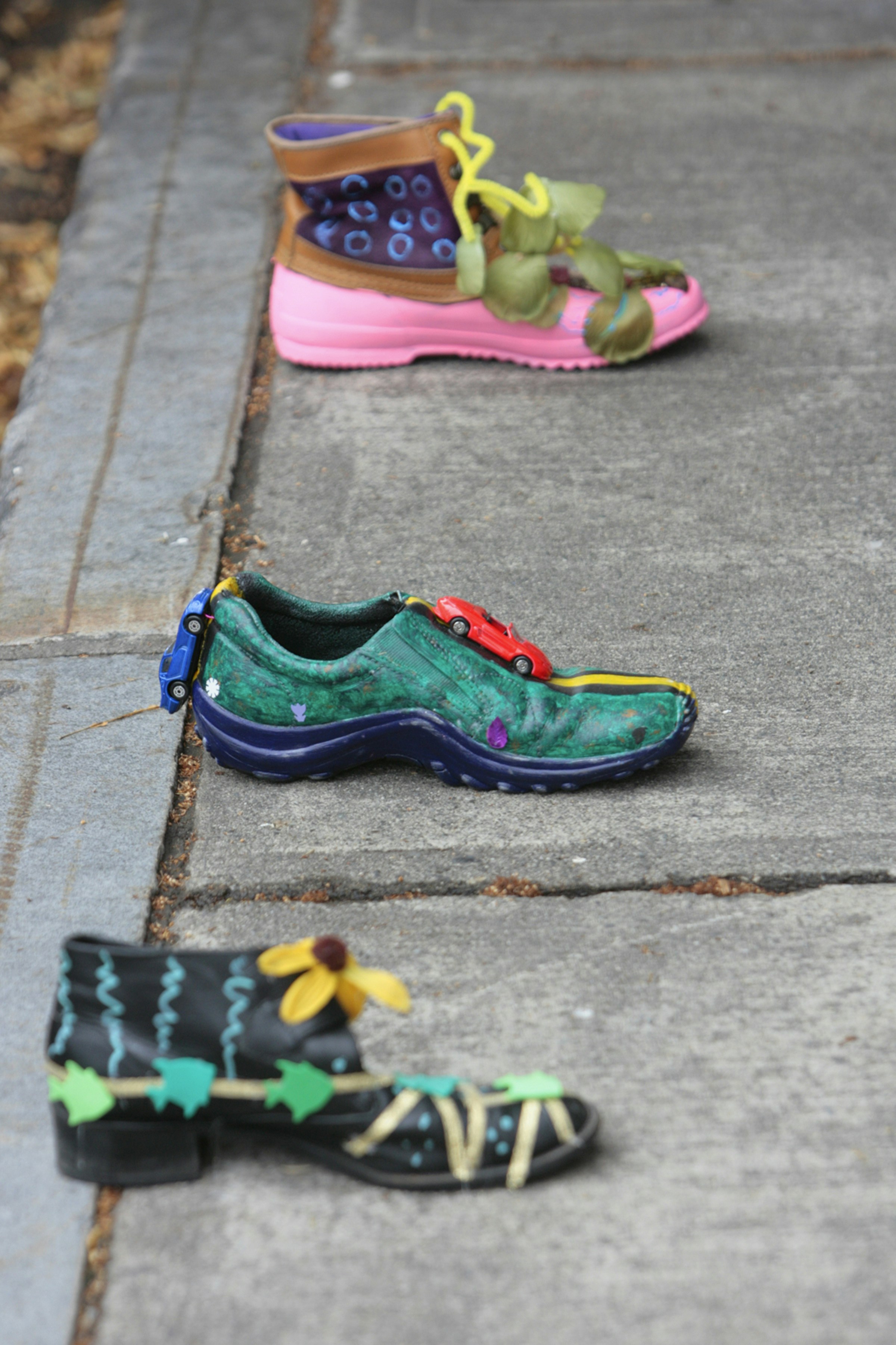 Green Sneaker Anchor: A Colorful Lineup on the Sidewalk