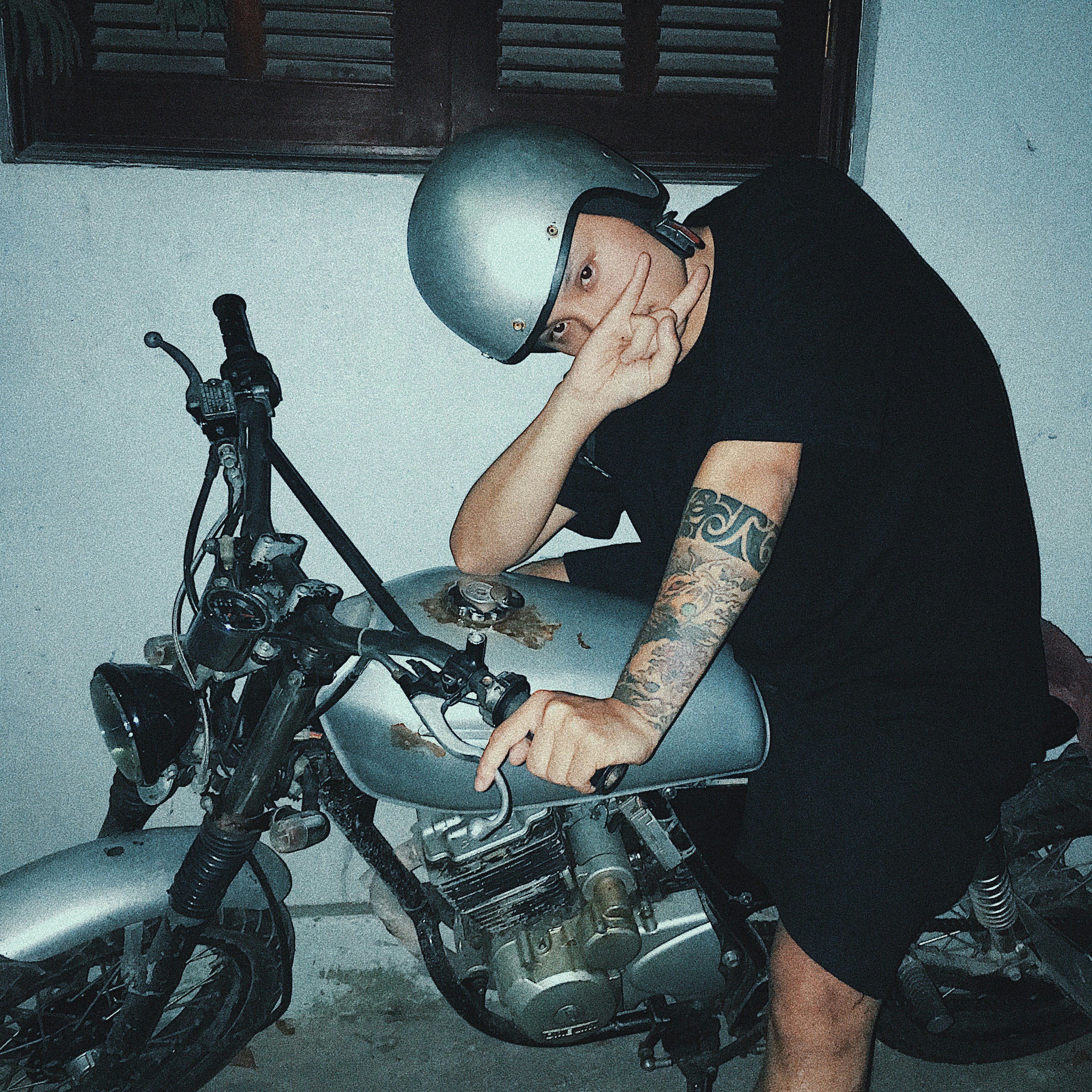 Glimpse of Steel: A Helmeted Gaze on a Quiet Garage Ride