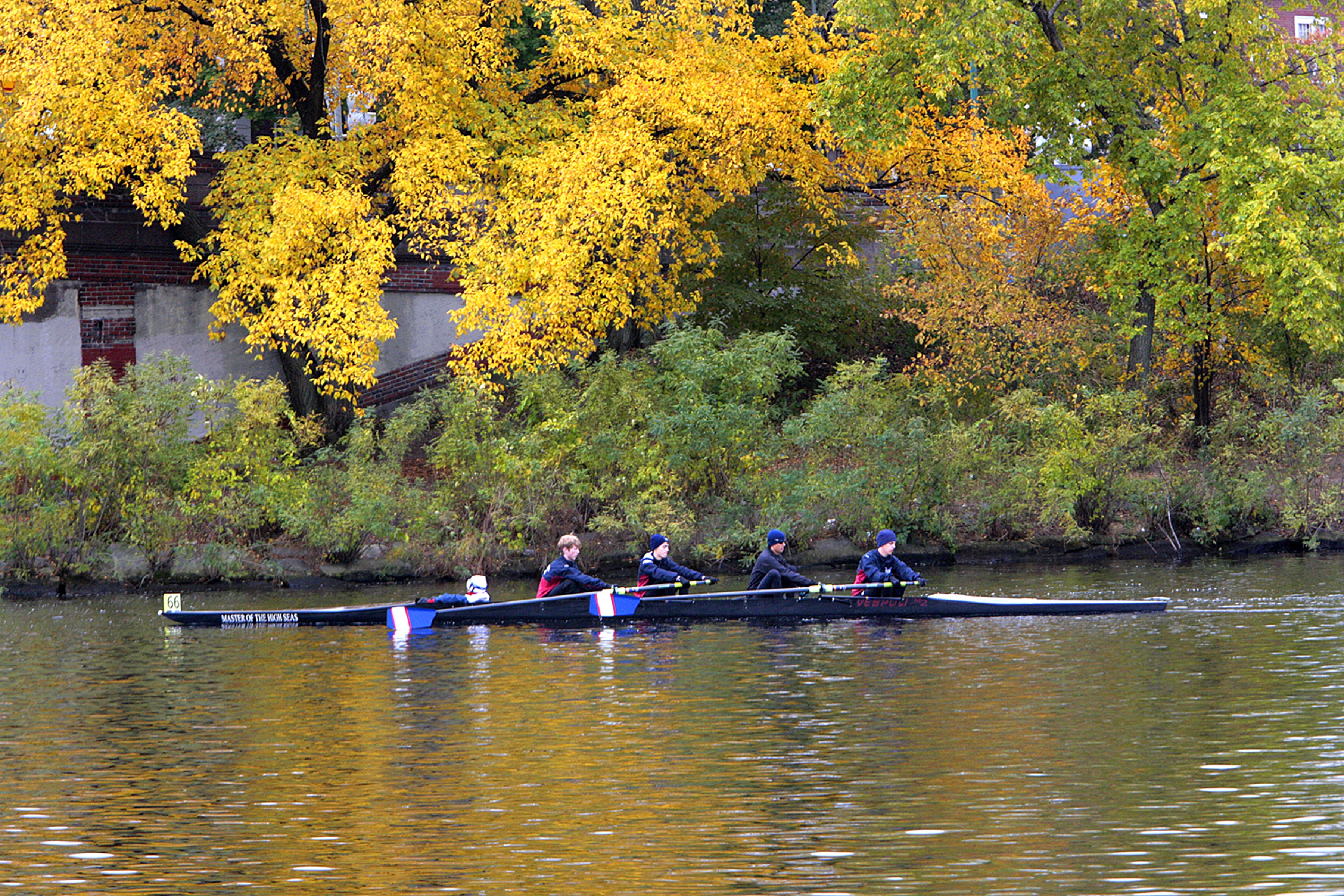 A group of people rowing a boat photo – Free Head of the charles ...