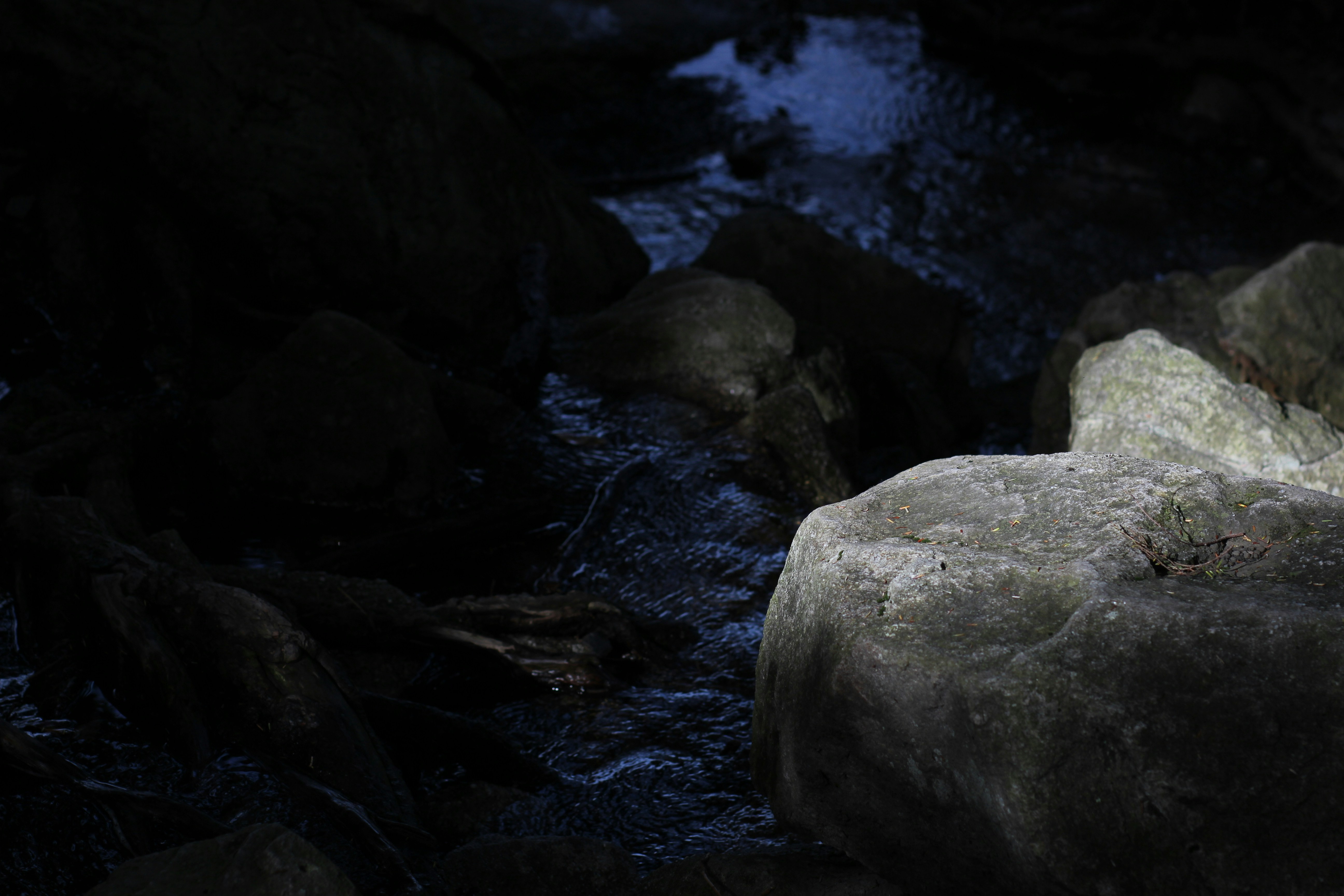 Moonlit Stones by a Quiet Creek