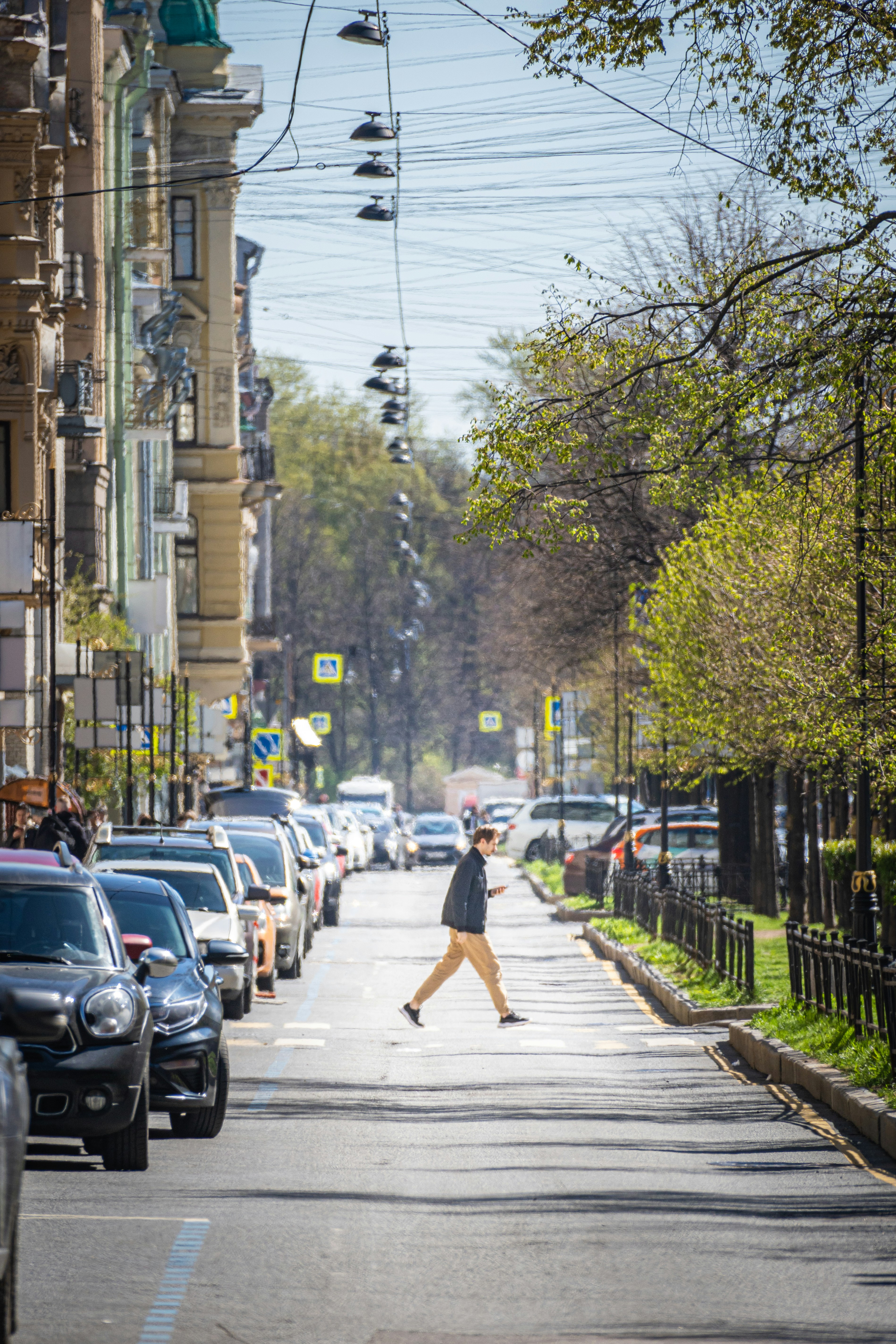 Crosswalk Moment: A Stride Through a Sunlit City Street