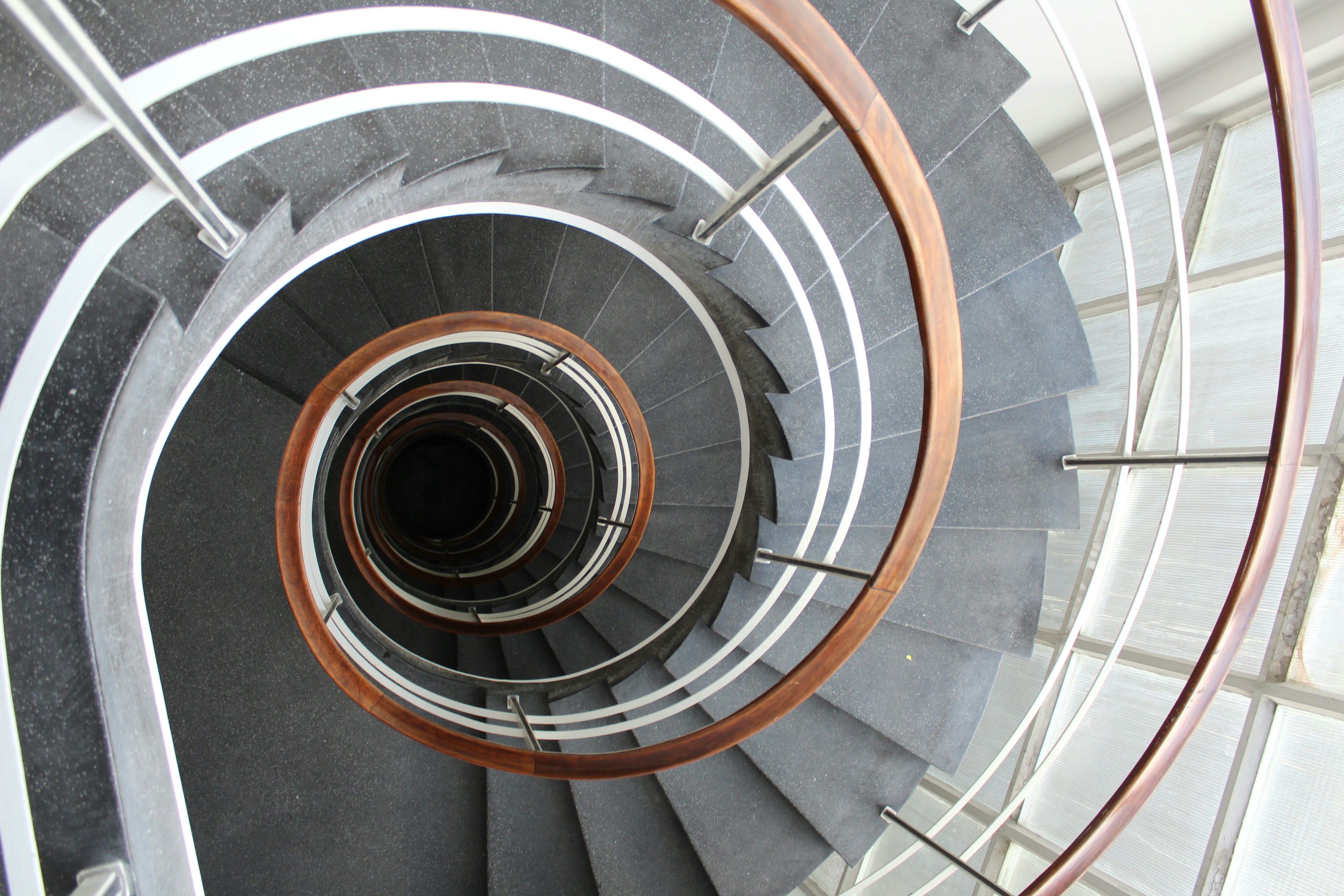 A spiral staircase with a circular opening photo – Free Portugal Image ...