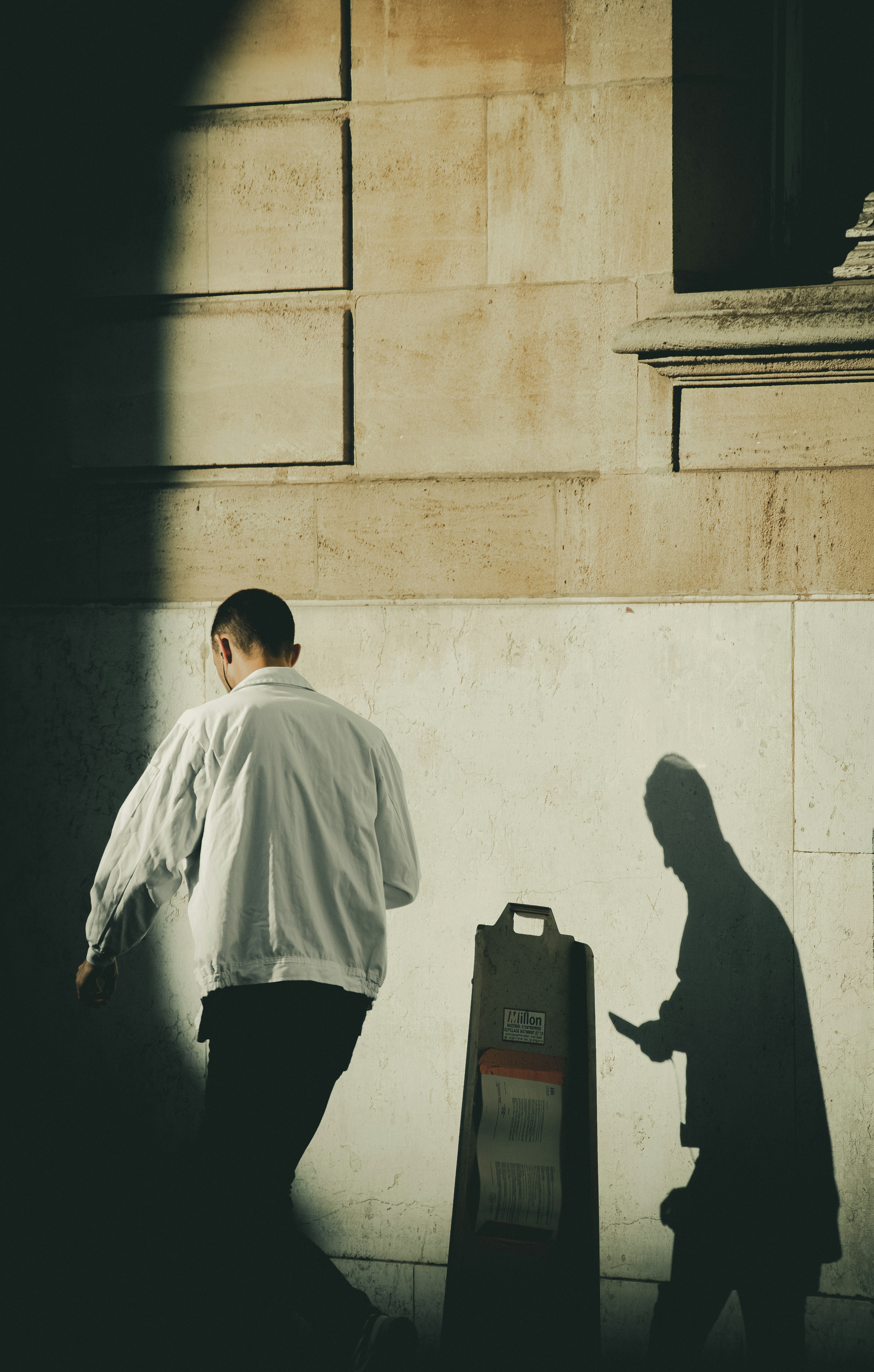 a person standing next to a box