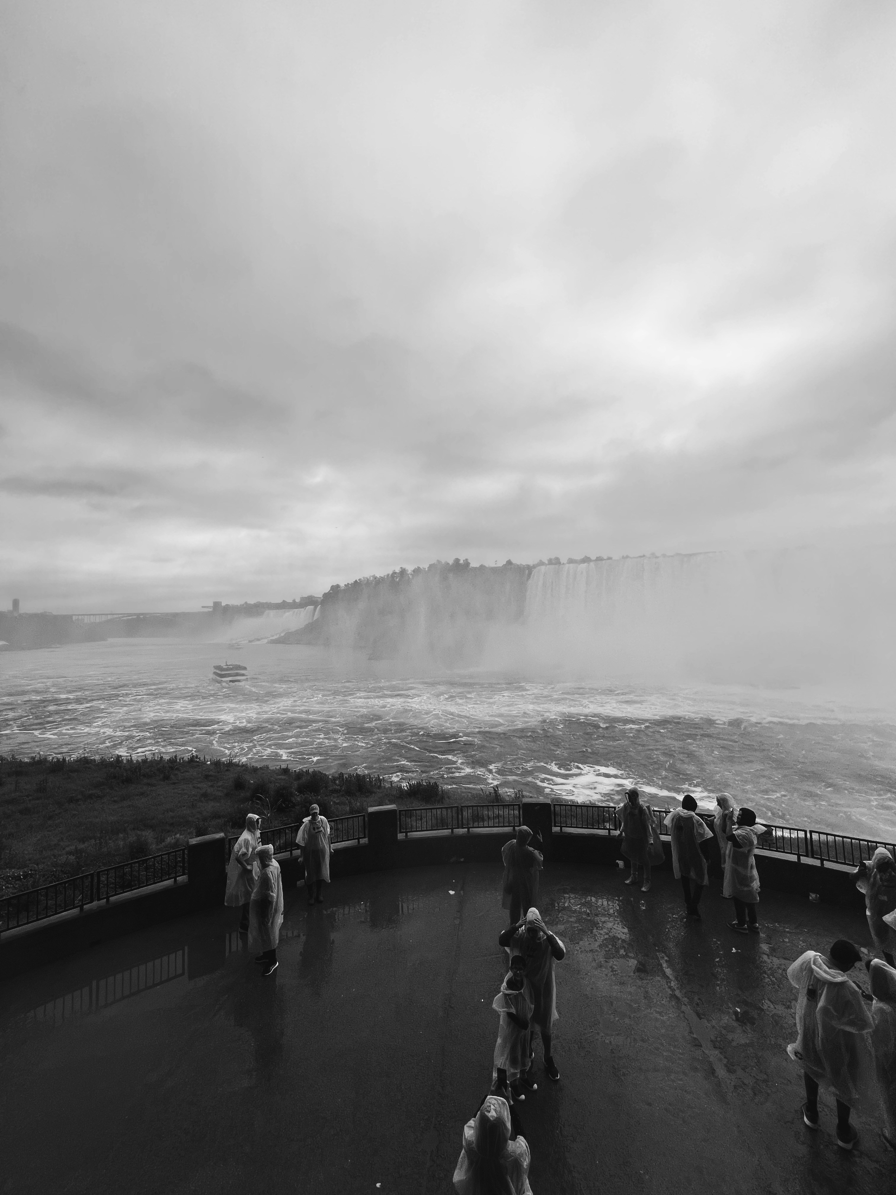 Niagara Mist Over the Overlook: Visitors on a Wet Deck Beneath a Veiled Cascade