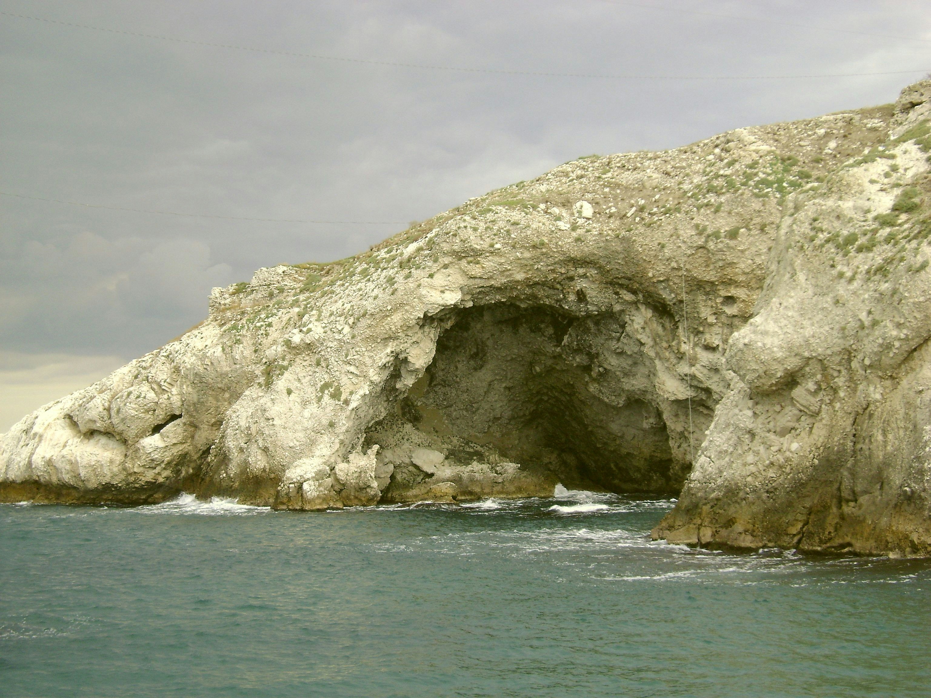 a large rock formation in the water