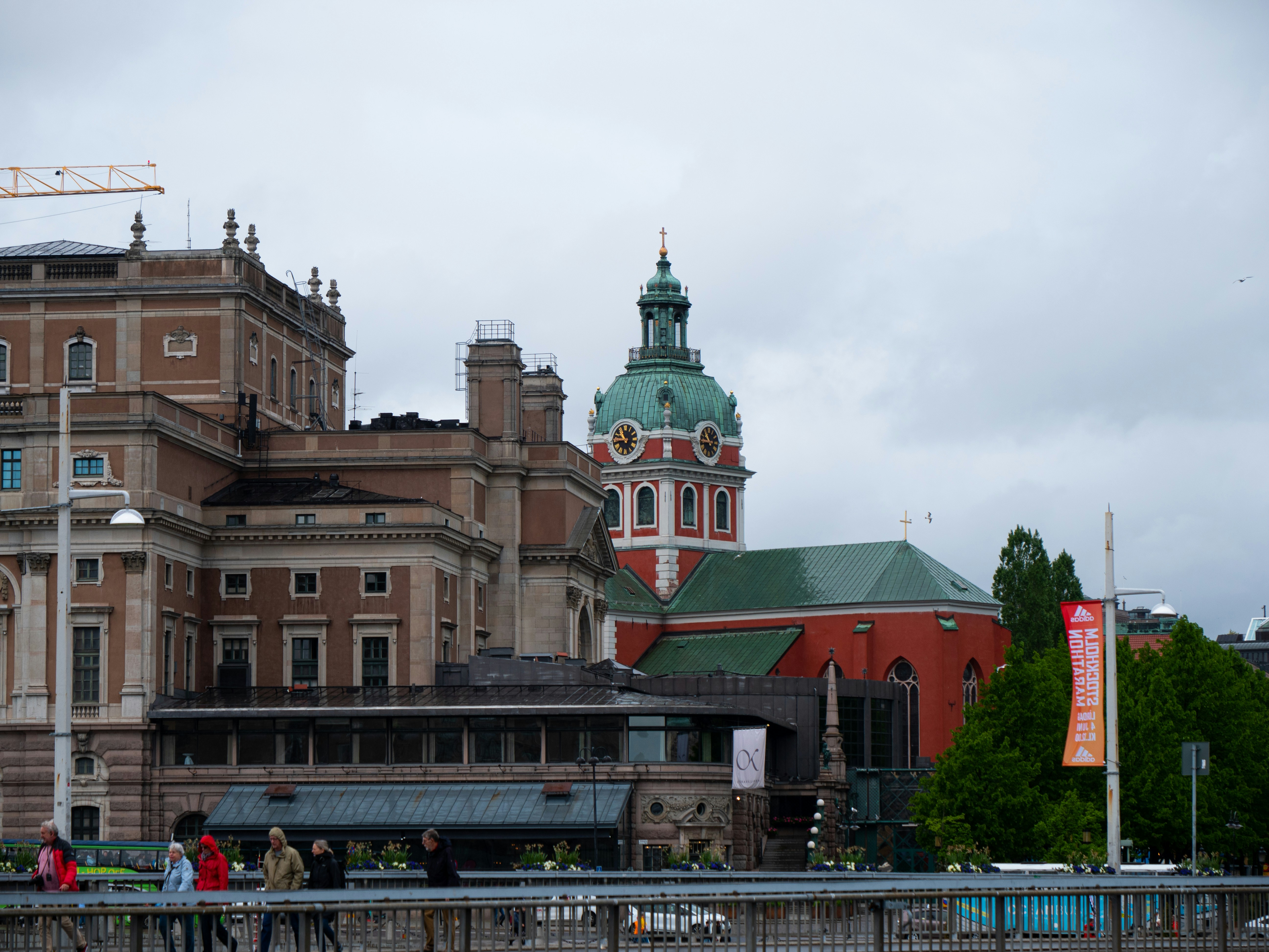 Emerald Cupola Over a Red-Brick Riverfront