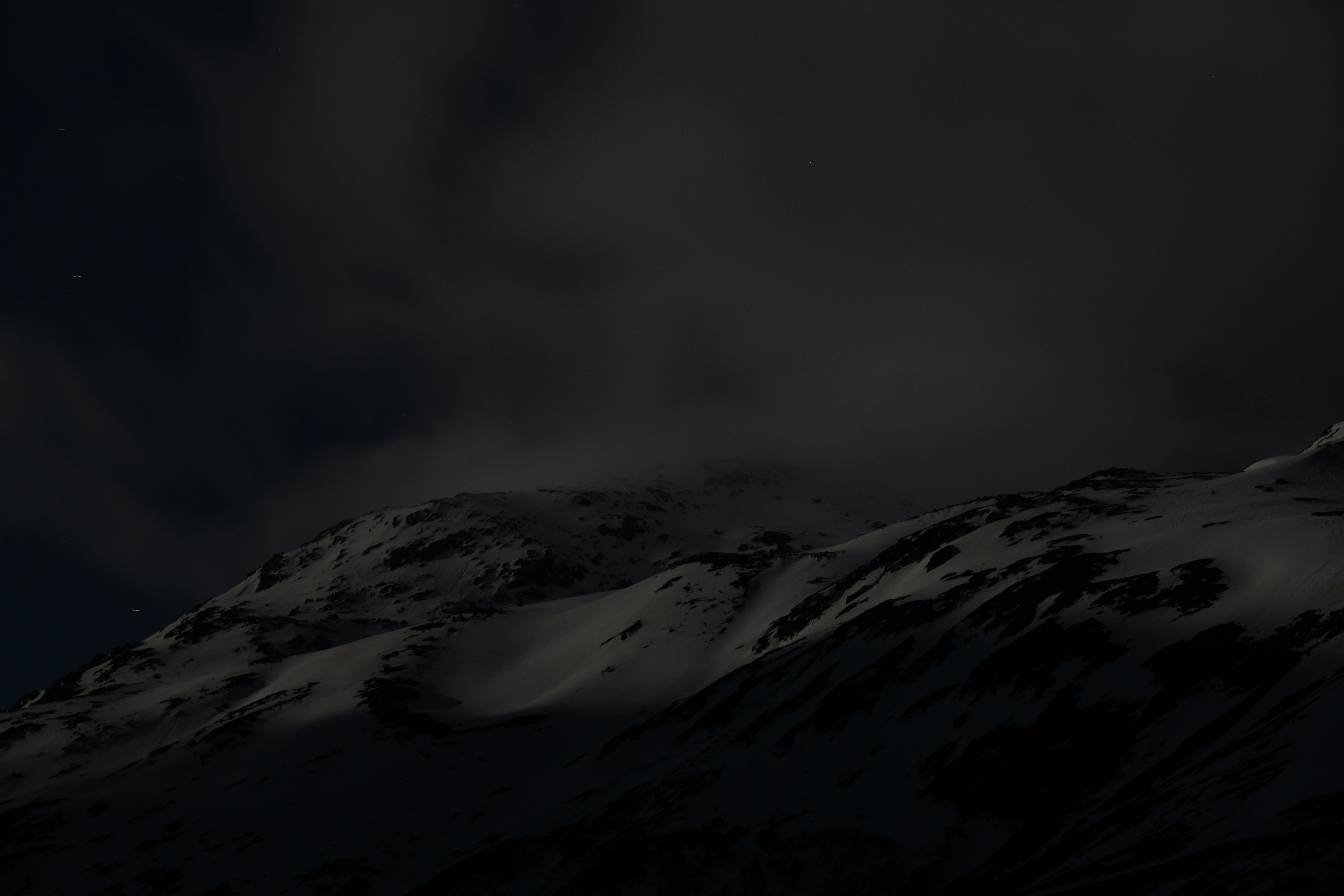 Dark Snowy Mountains