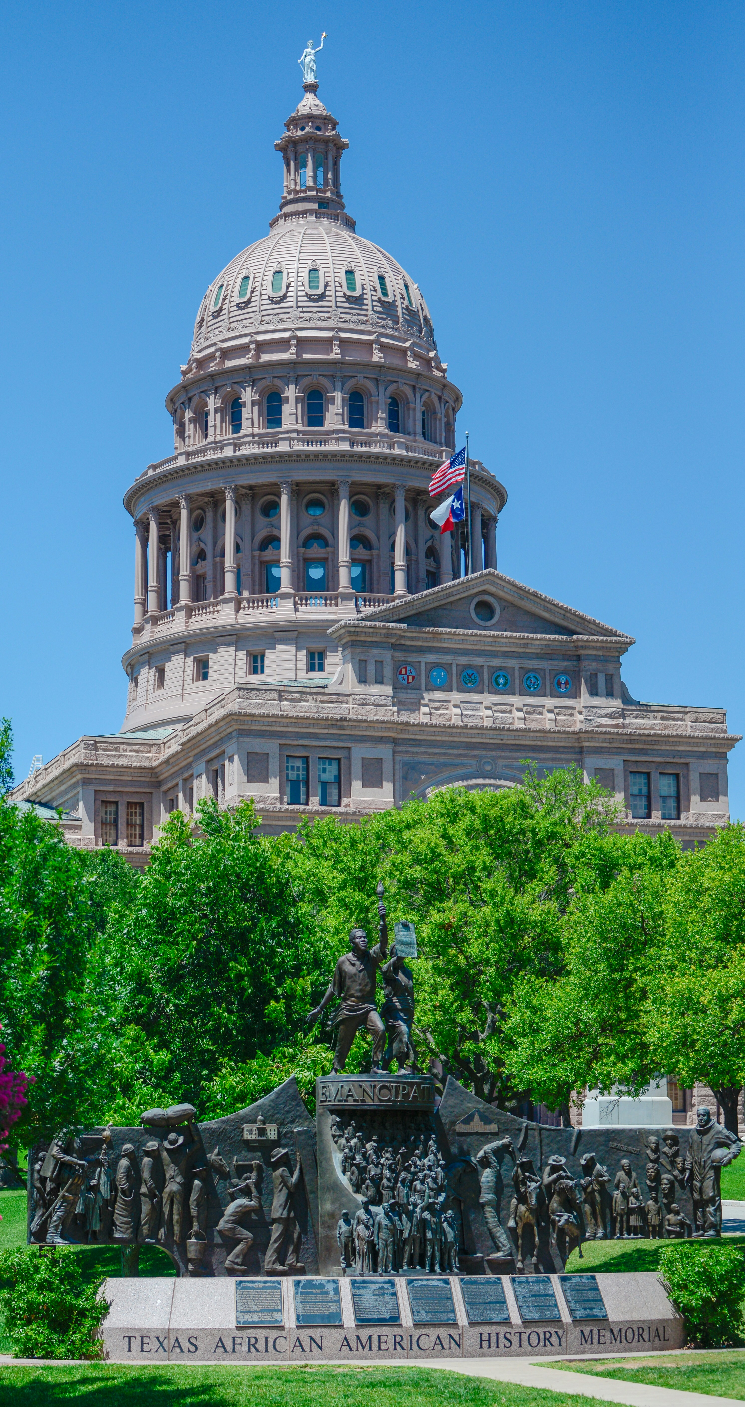 Texas State Capitol with a dome and statues in front of it photo – Free ...