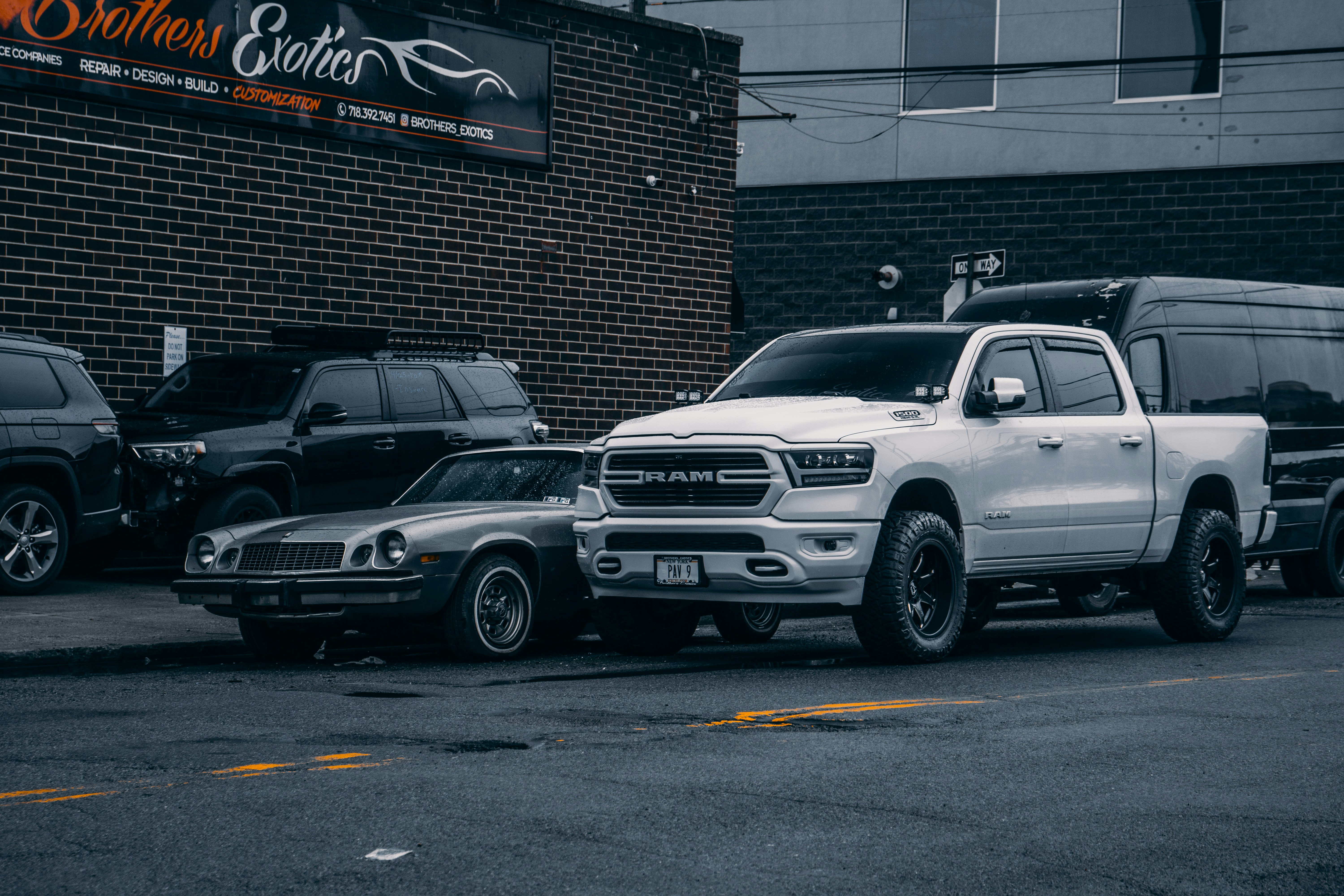 a group of cars parked in a parking lot