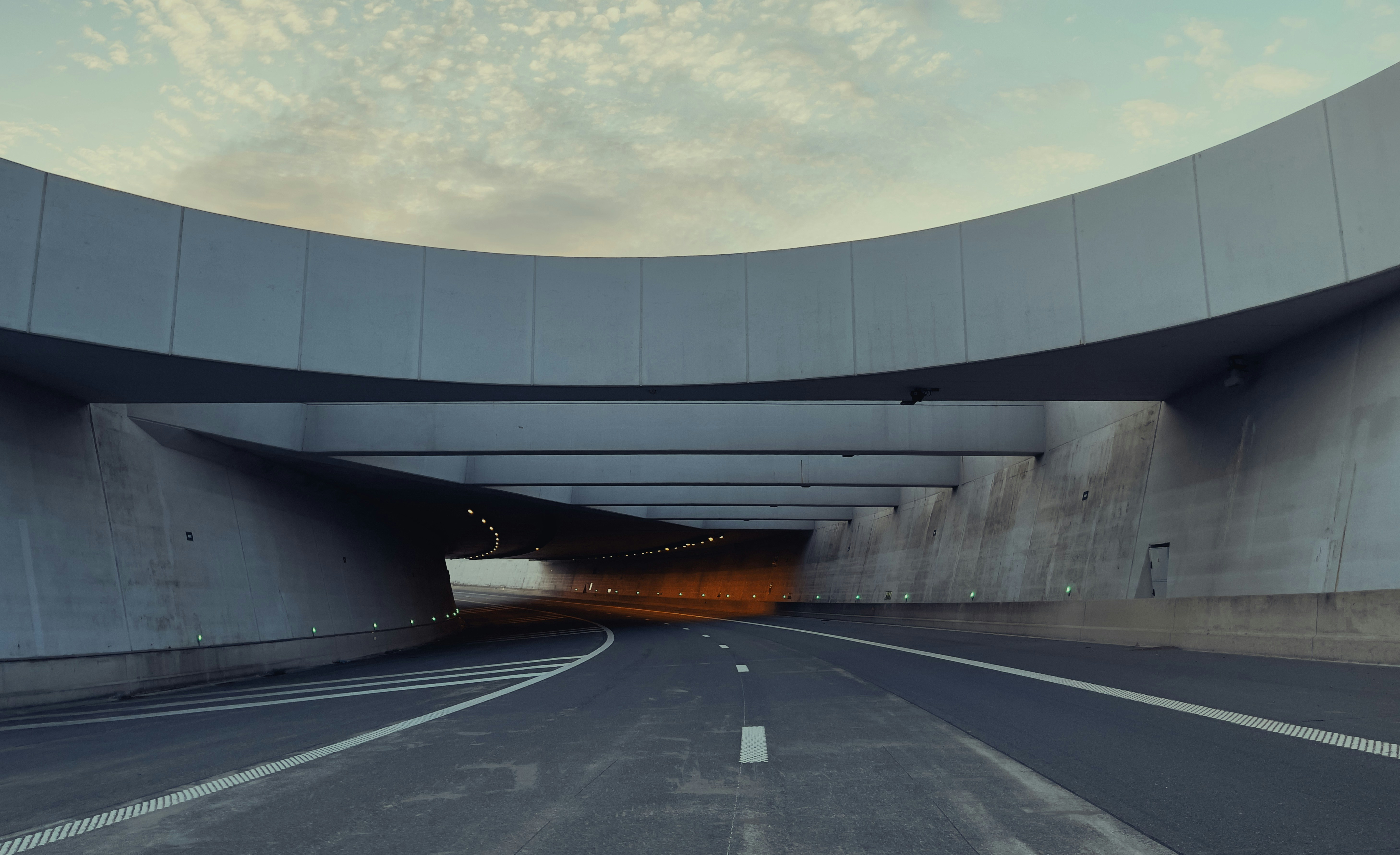 Convergence Under a Crescent Overpass: Highway Recedes into a Concrete Tunnel