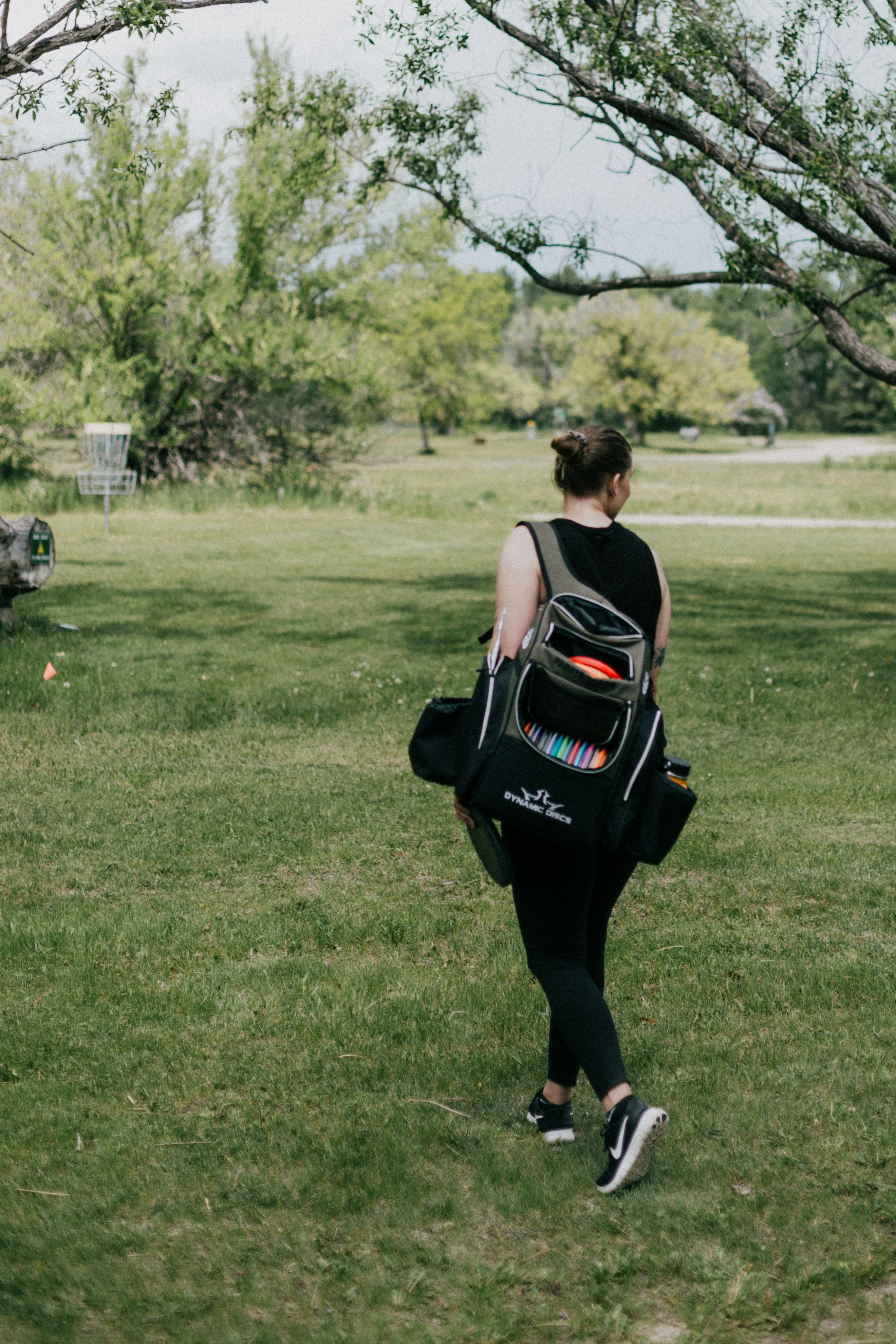 Colorful Discs in Transit: A Disc Golf Bag Trek Through a Park