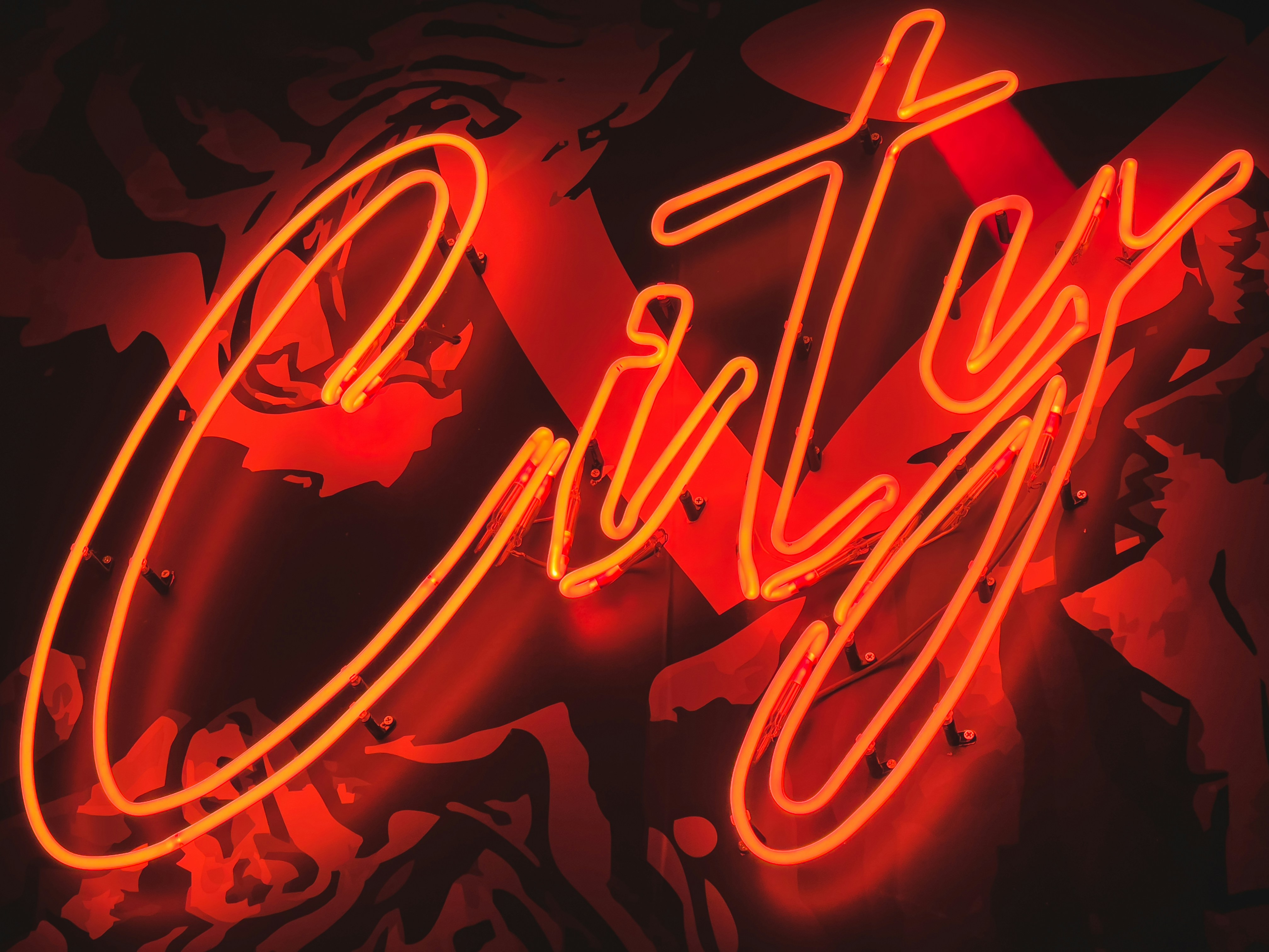 A sign with orange text photo – Free Street Image on Unsplash