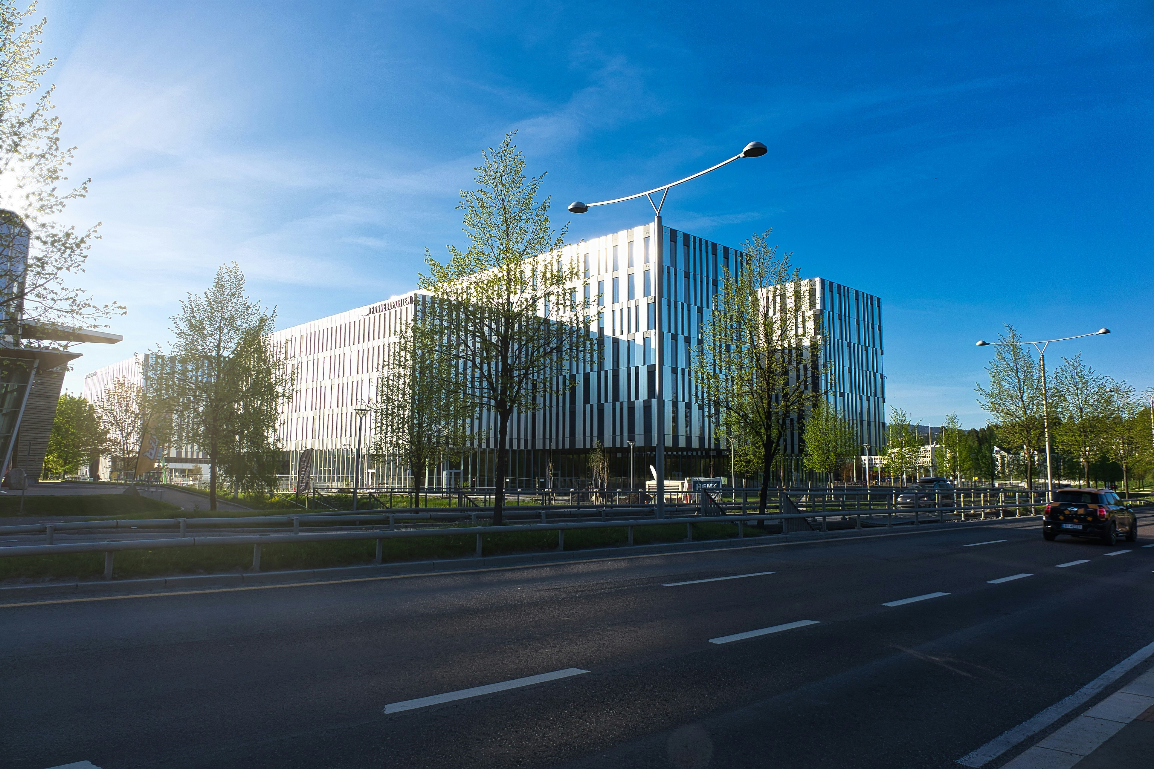 a road with a building in the background
