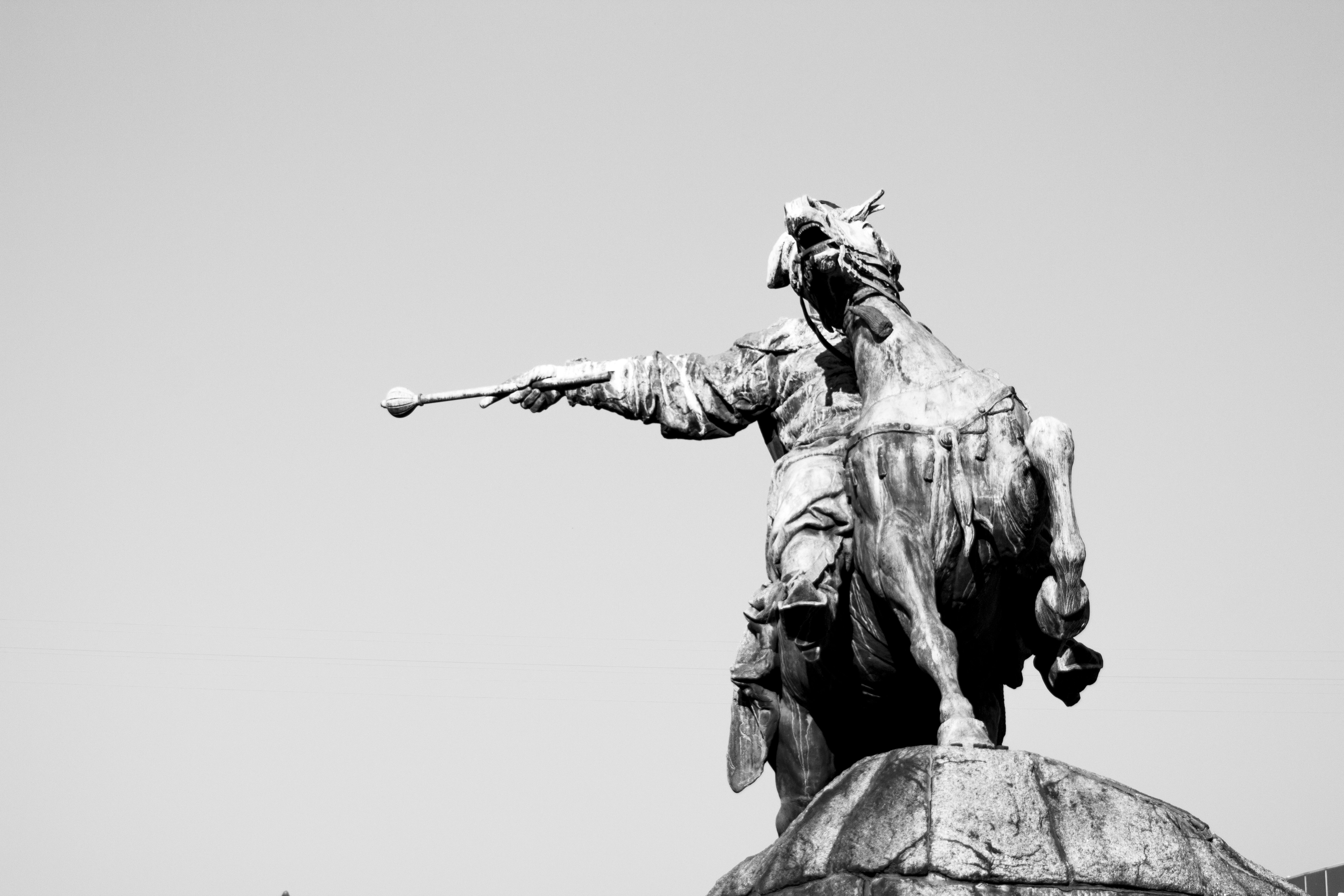 a statue of a person holding a sword