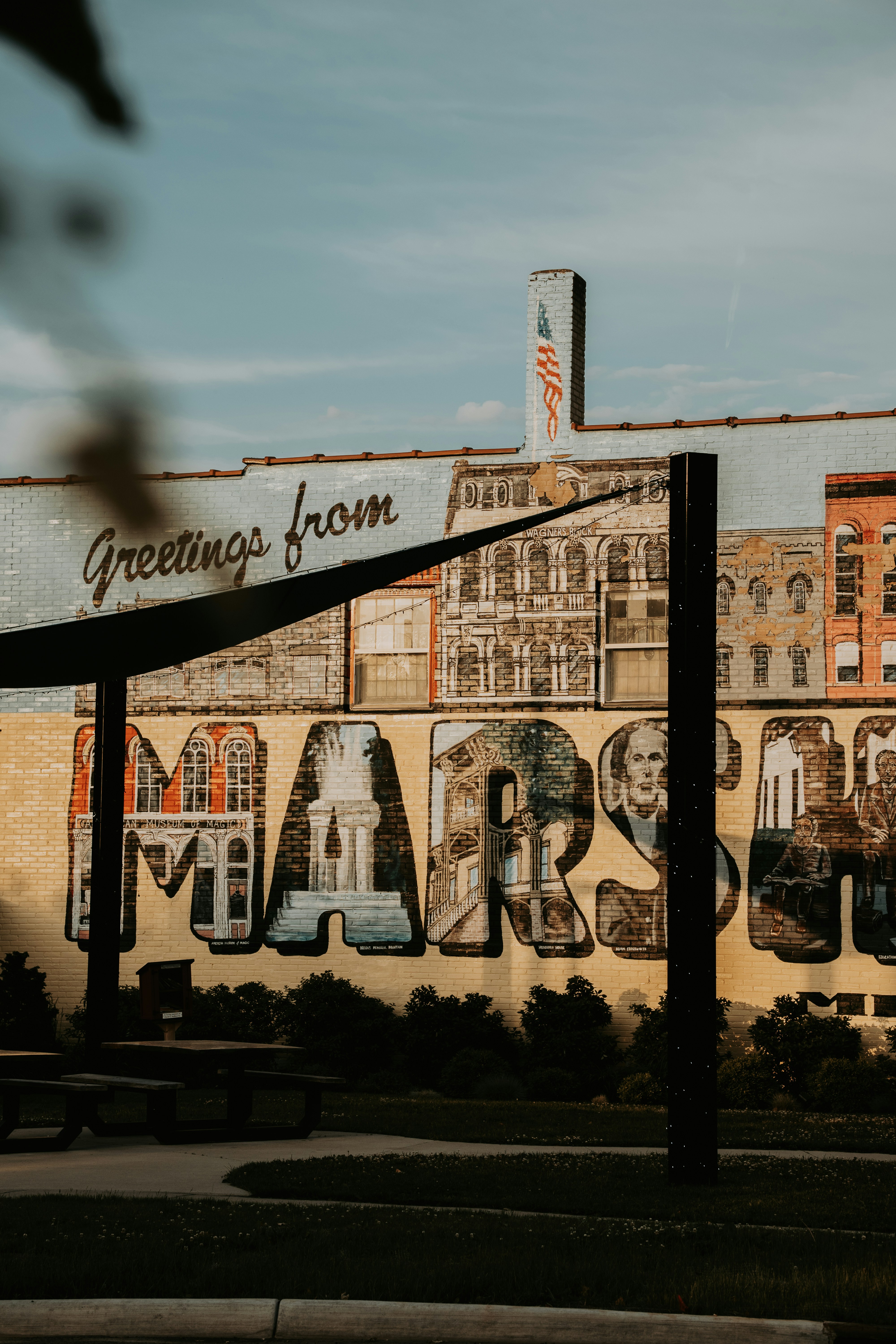 Greetings from Mars: Portrait-Letter Mural in Sunlit Park