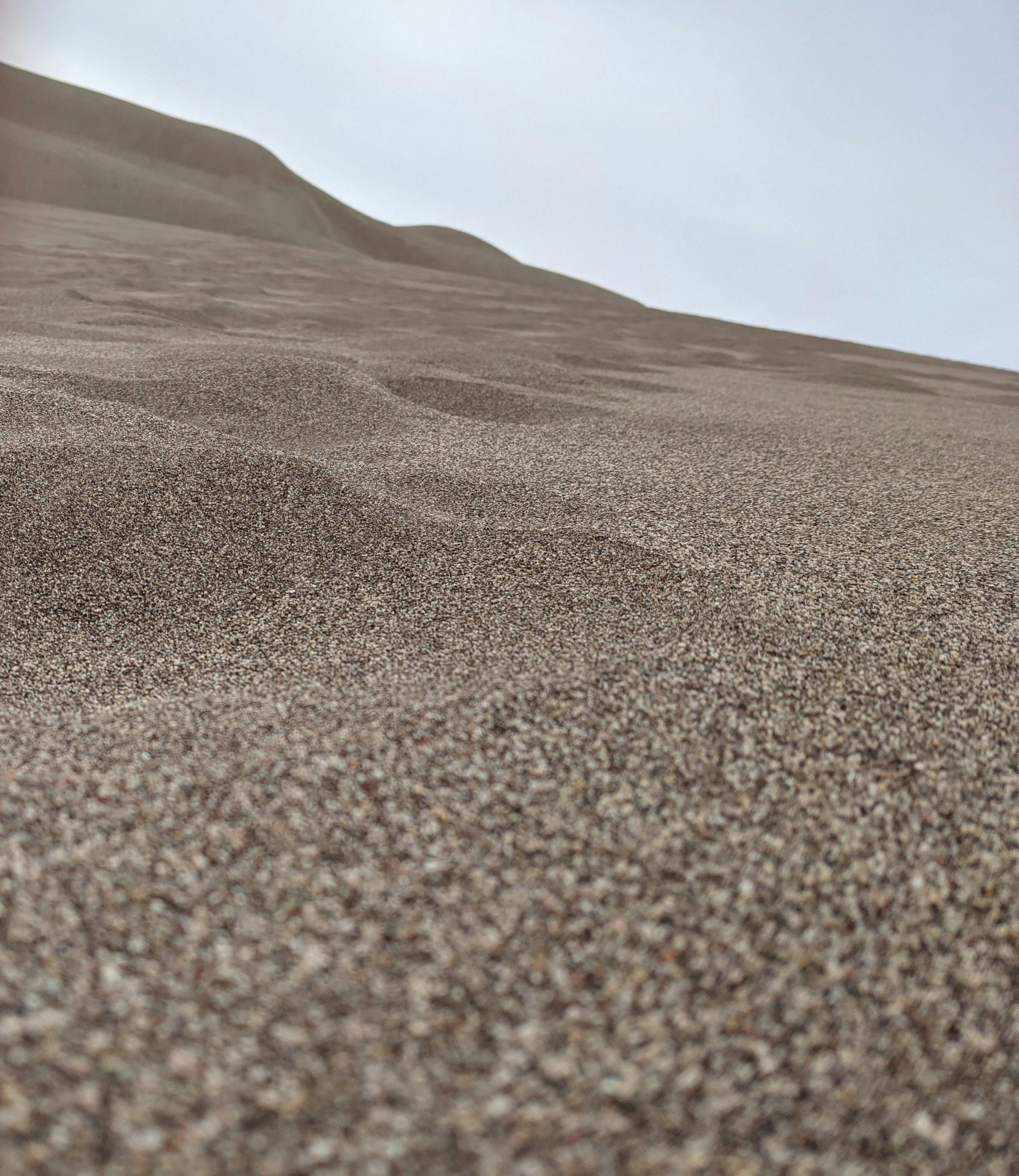 A large flat area with a hill in the background photo – Free Grey Image ...