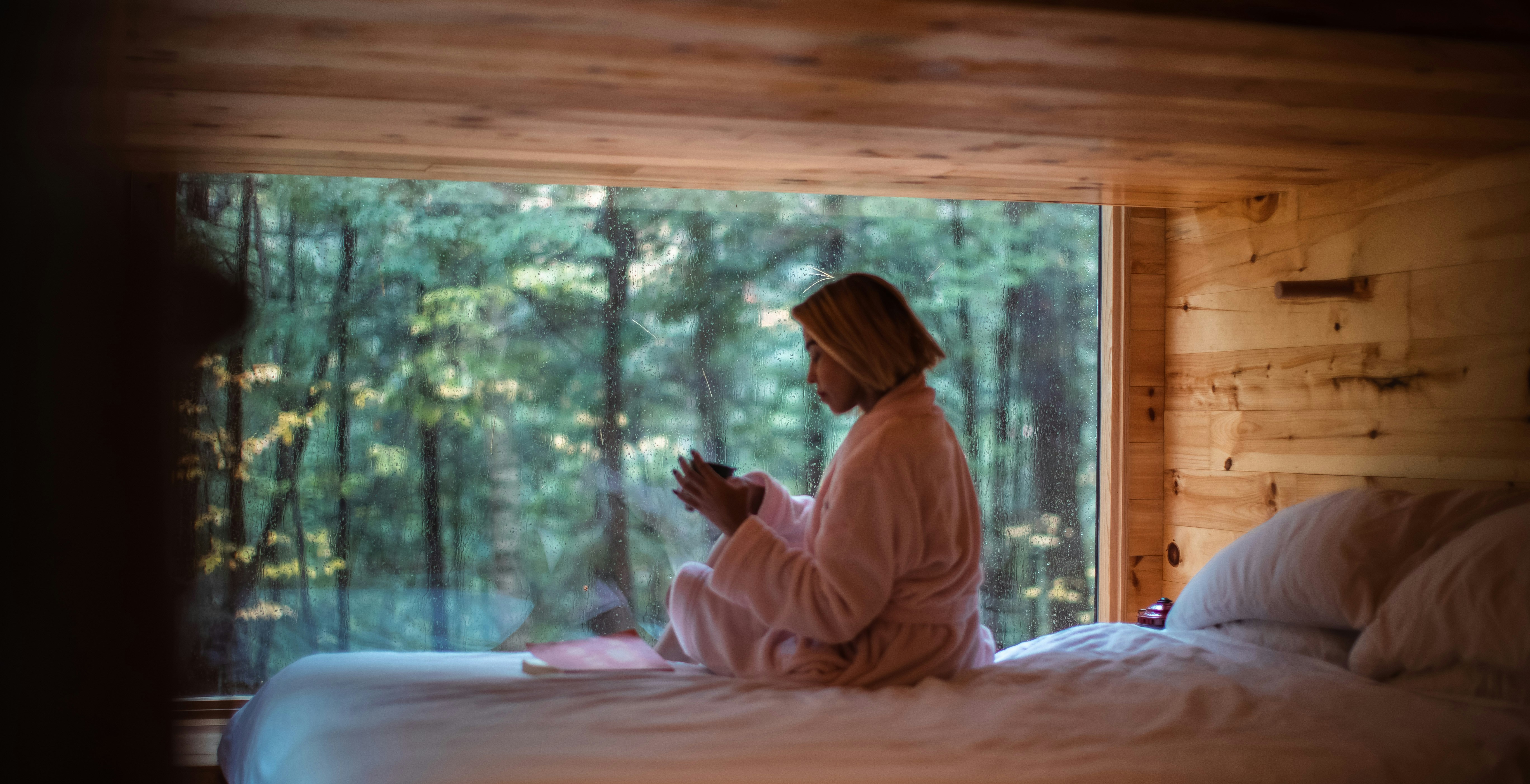 a man sitting on a bed