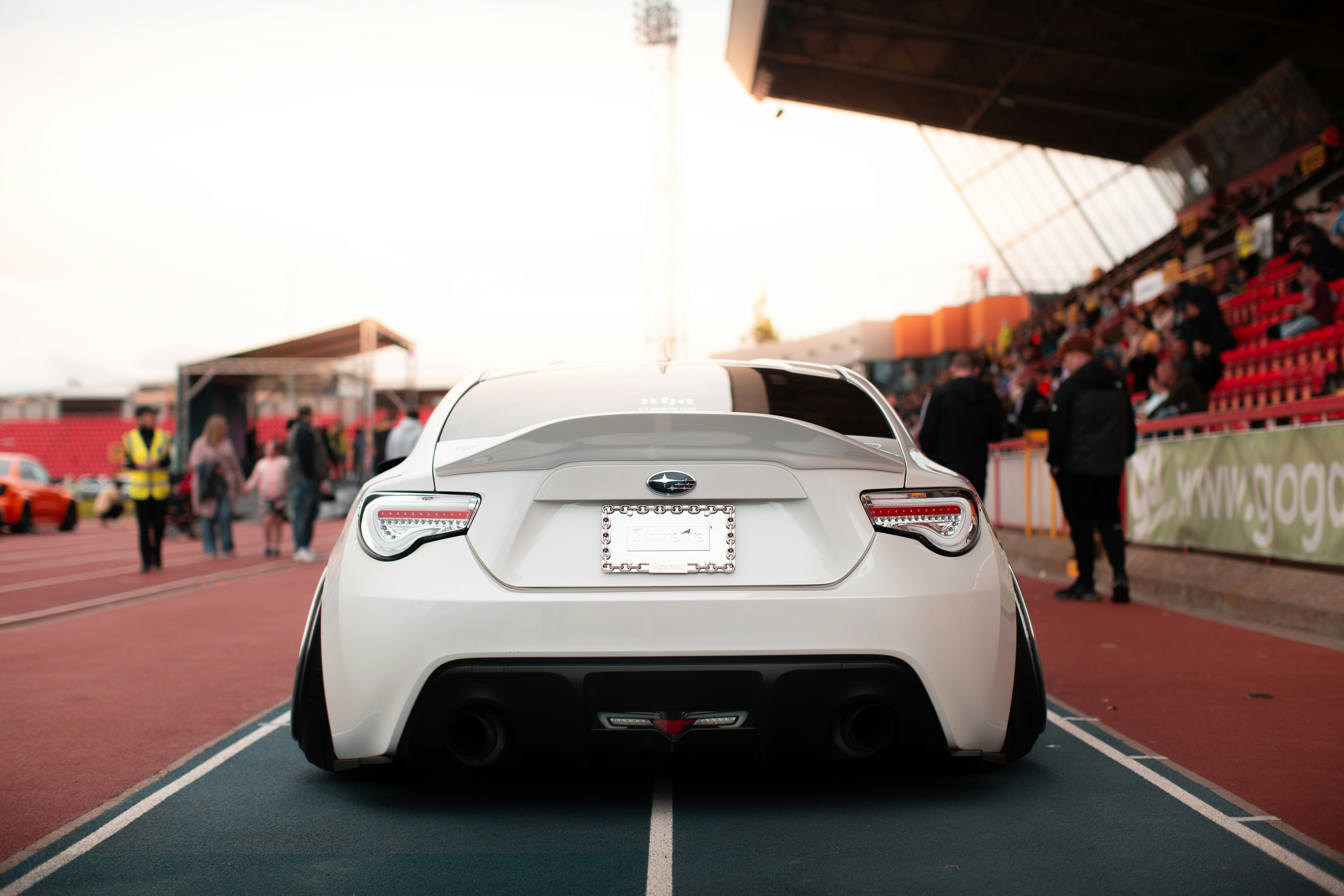 A white sports car on a race track photo – Free Stance car Image on ...