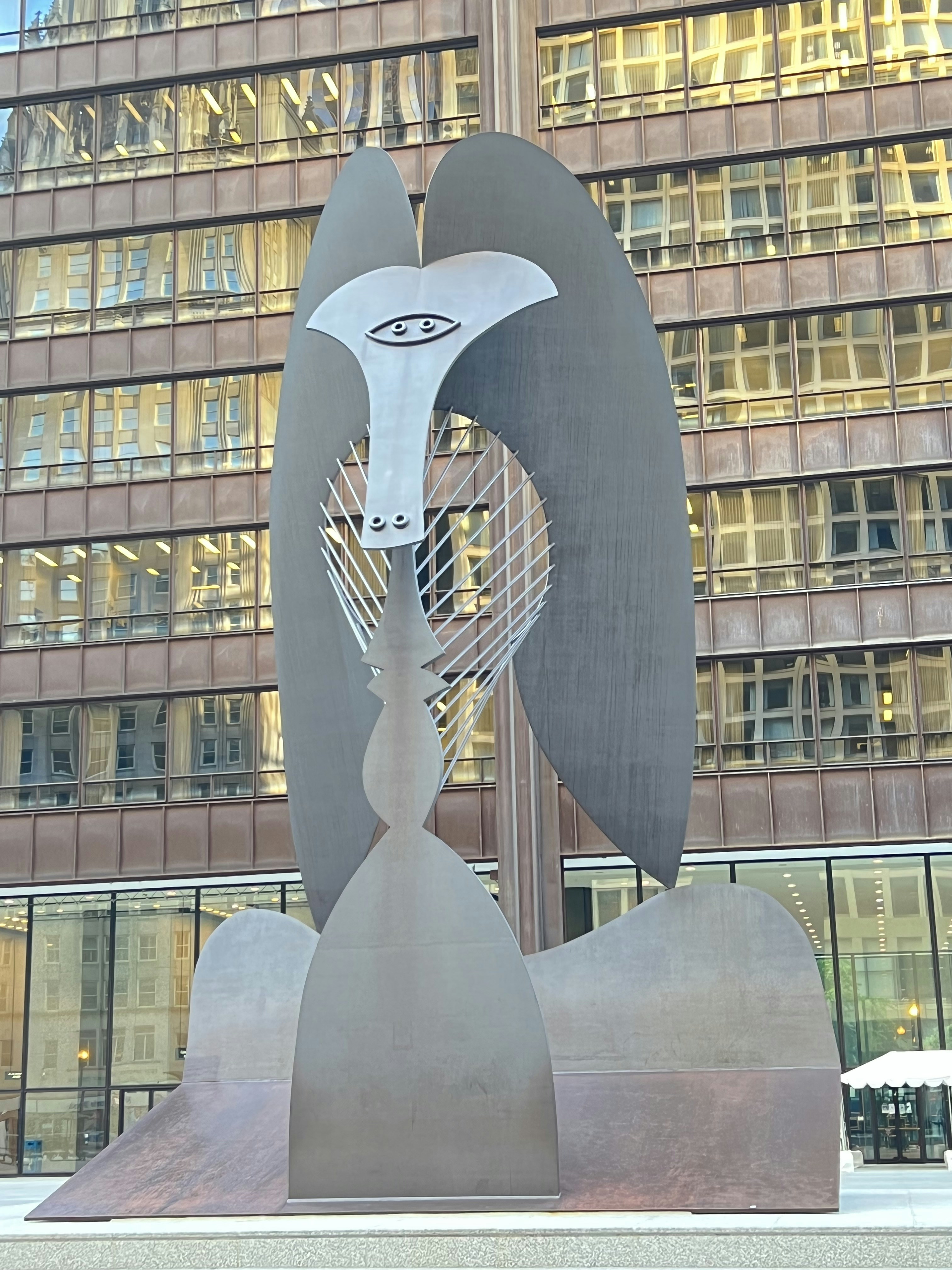 a statue in front of a building
