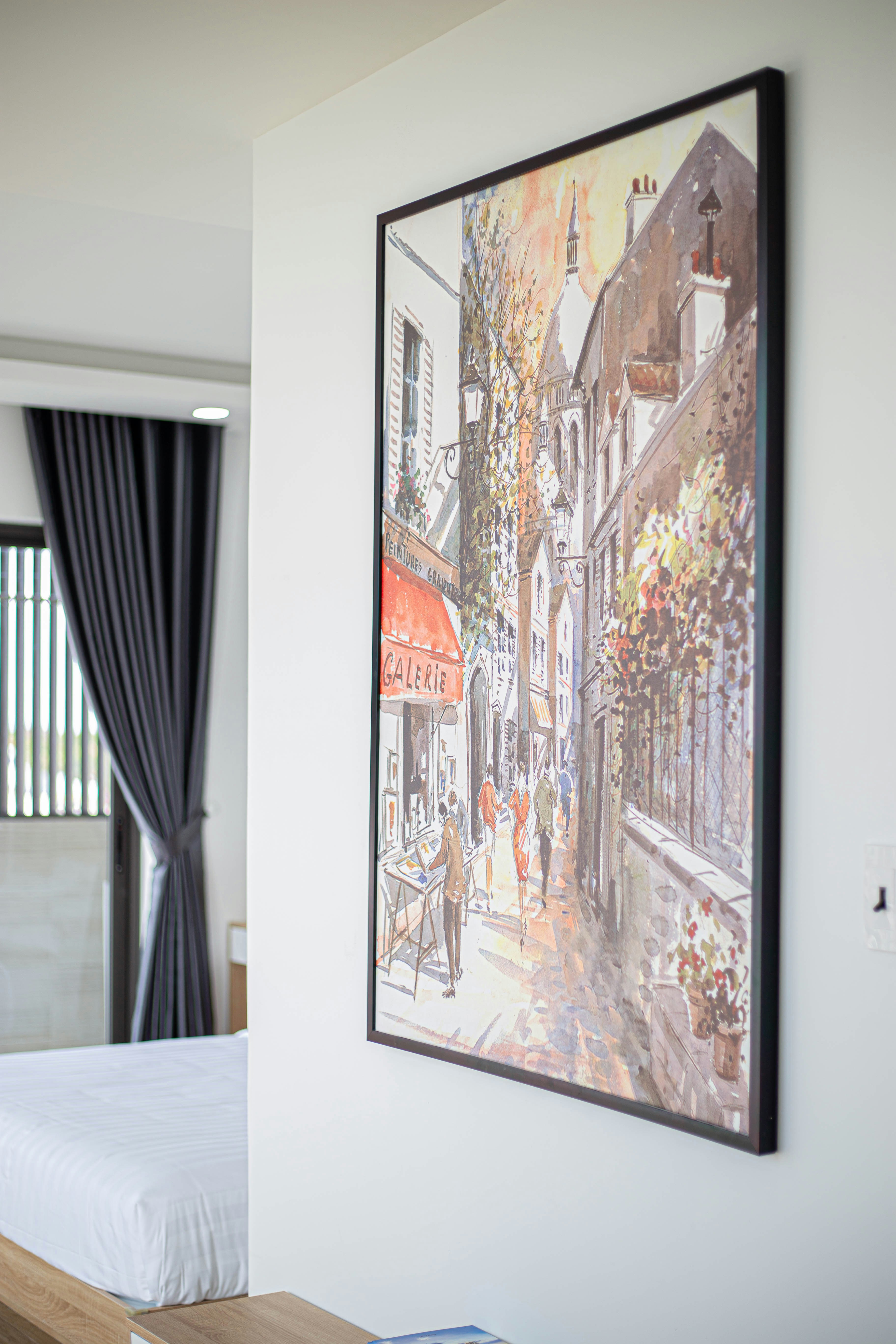 Framed Street Scene: A Painting-Like Gallery Adorns a Modern Wall