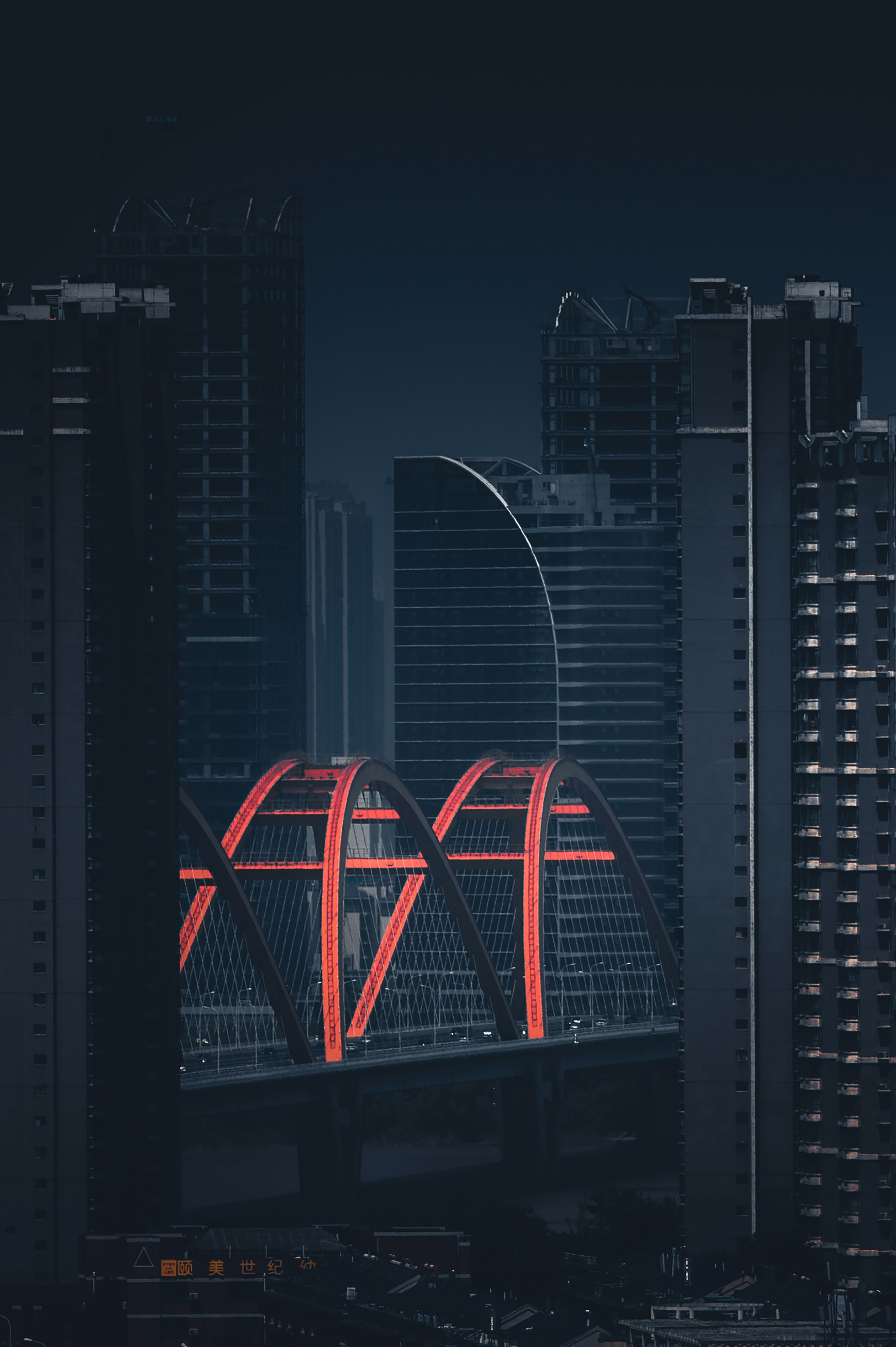 Crimson Arches Crown the Night: a Neon-Lined Cityscape