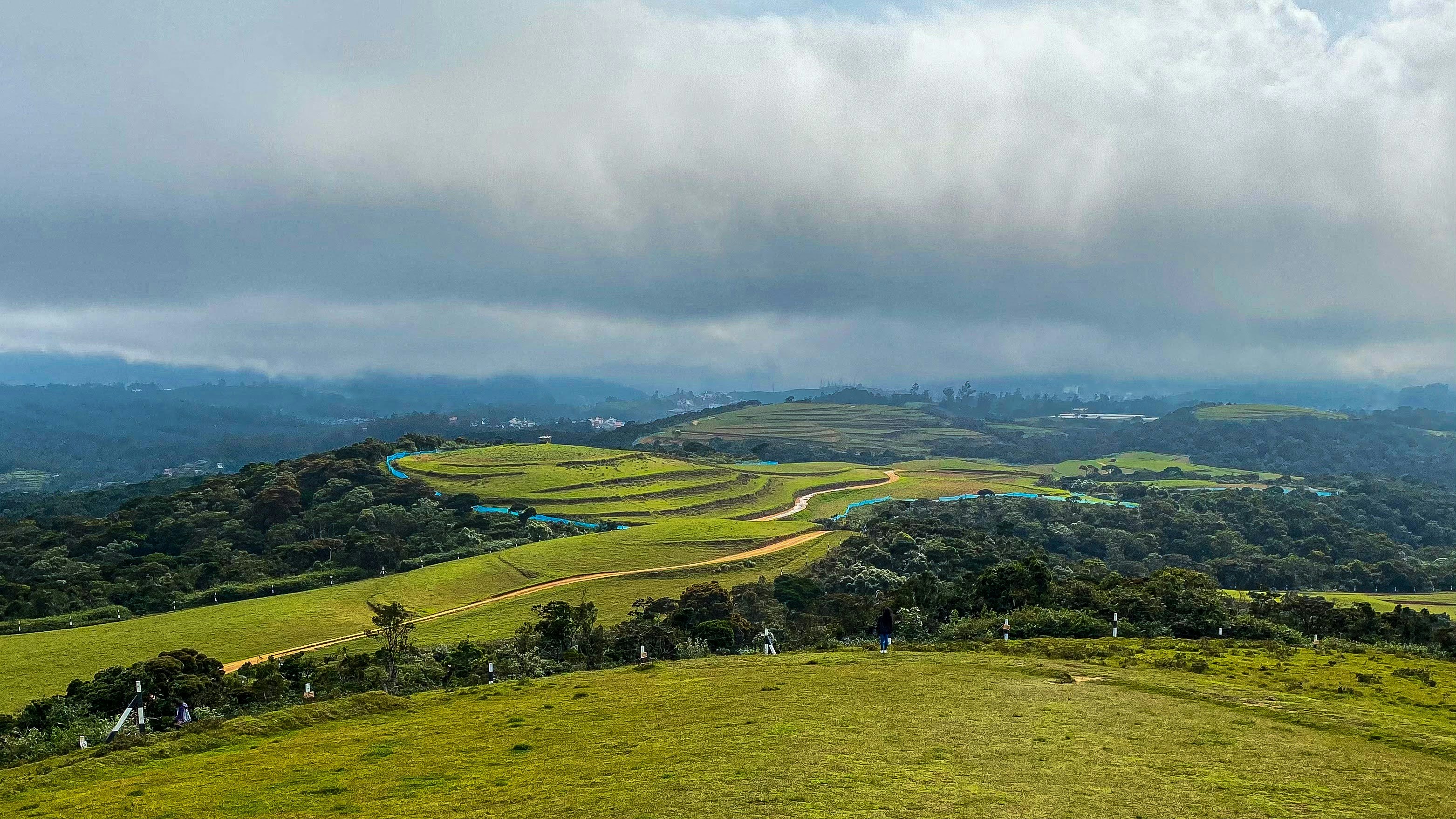 Moon Plains ~ (Sandathanna) Situated in the corner of the beautiful city Nuwara Eliya is a landscape with a grander view.