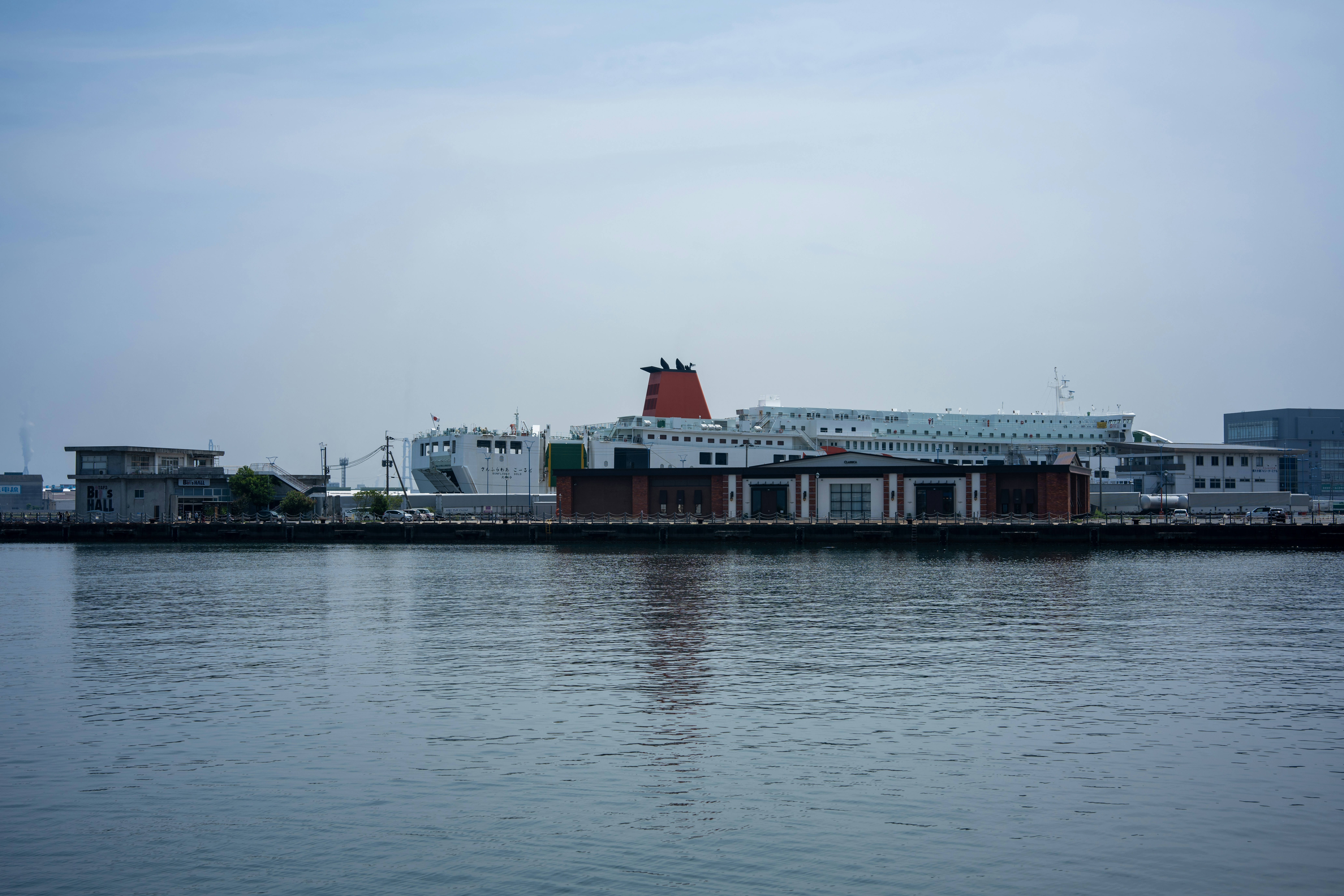 a large building next to a body of water