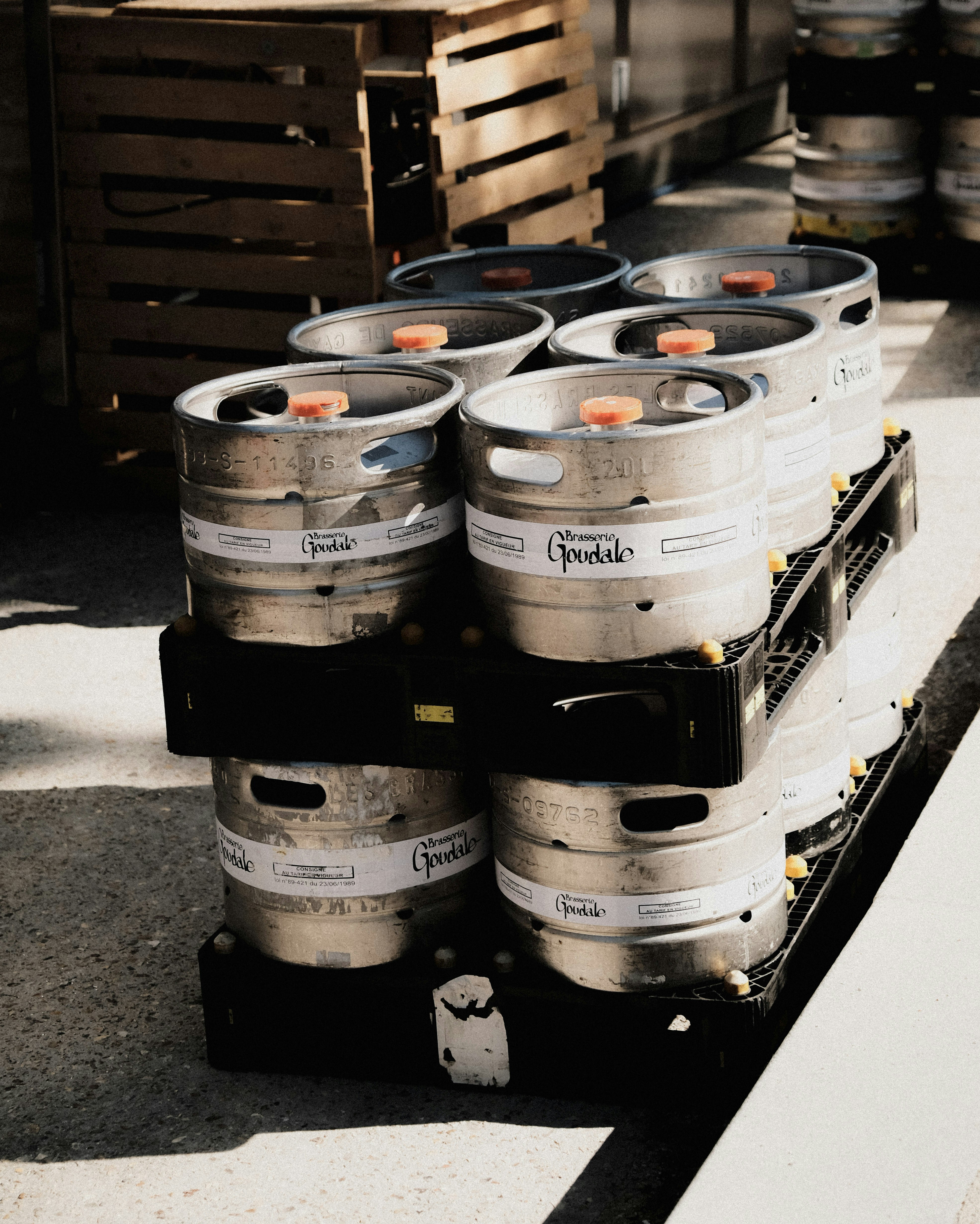 Stacks of Kegs Under Industrial Light