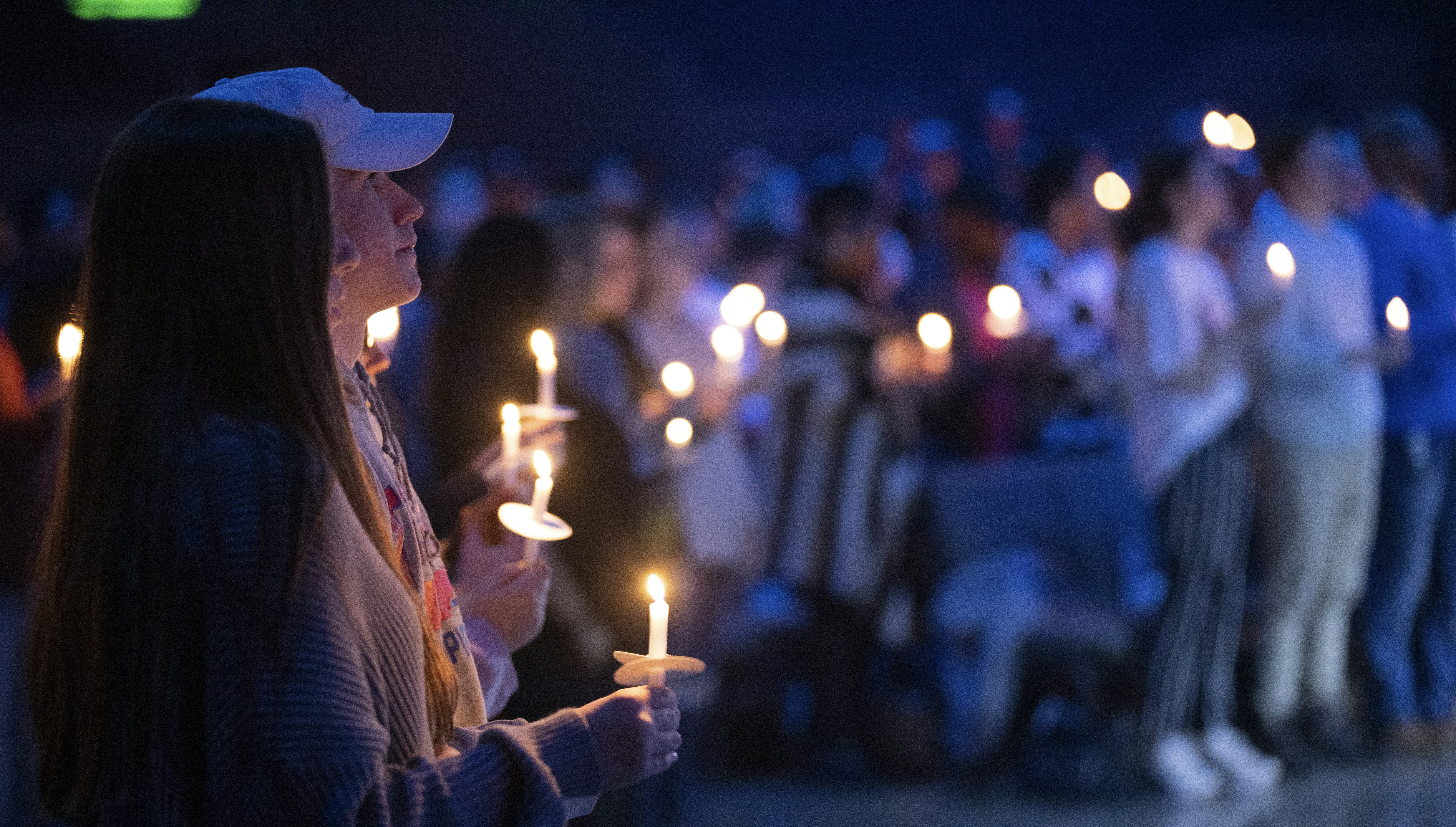 Candlelit Vigil: Faces in Quiet Focus