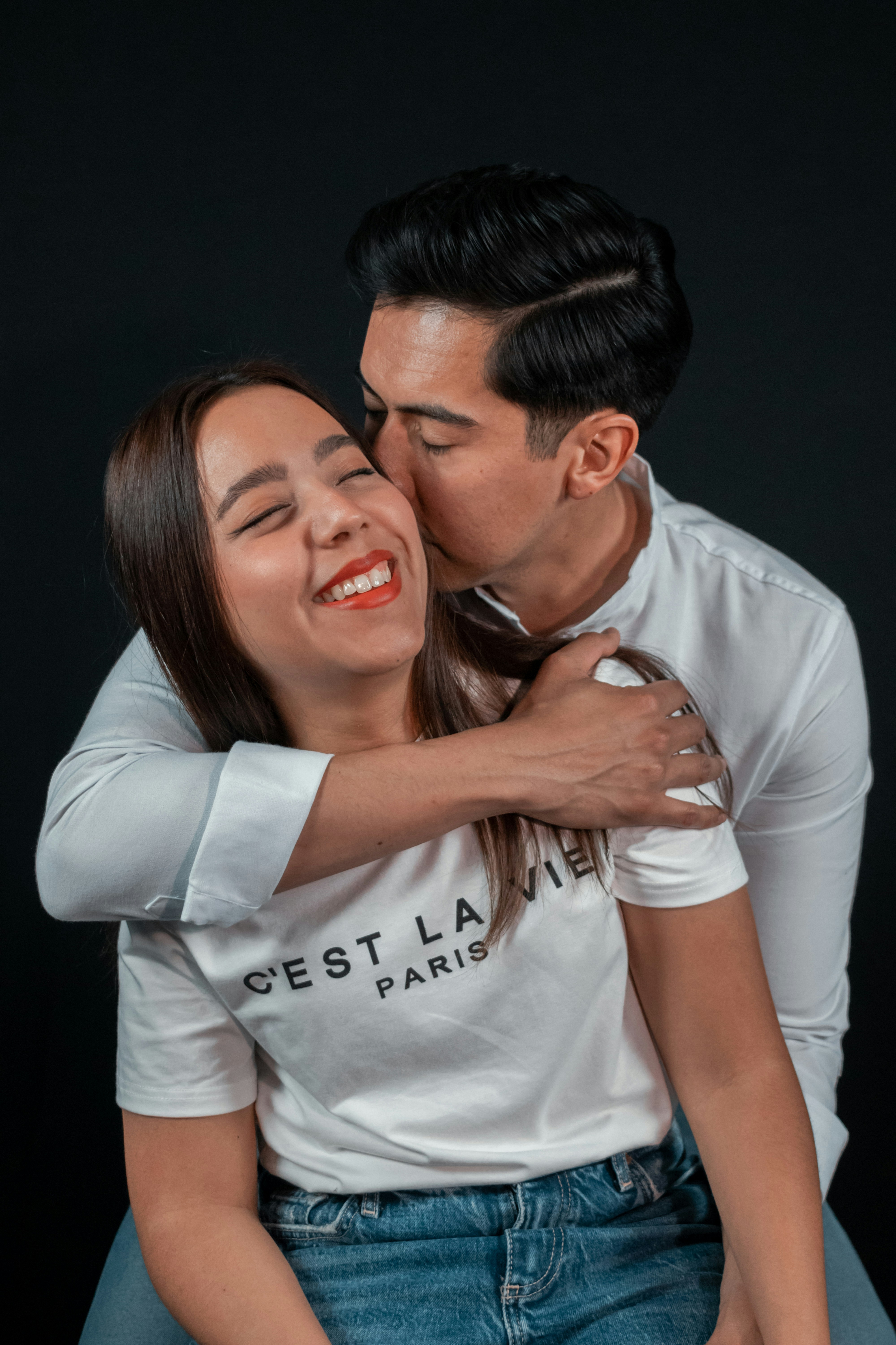 a man and woman kissing