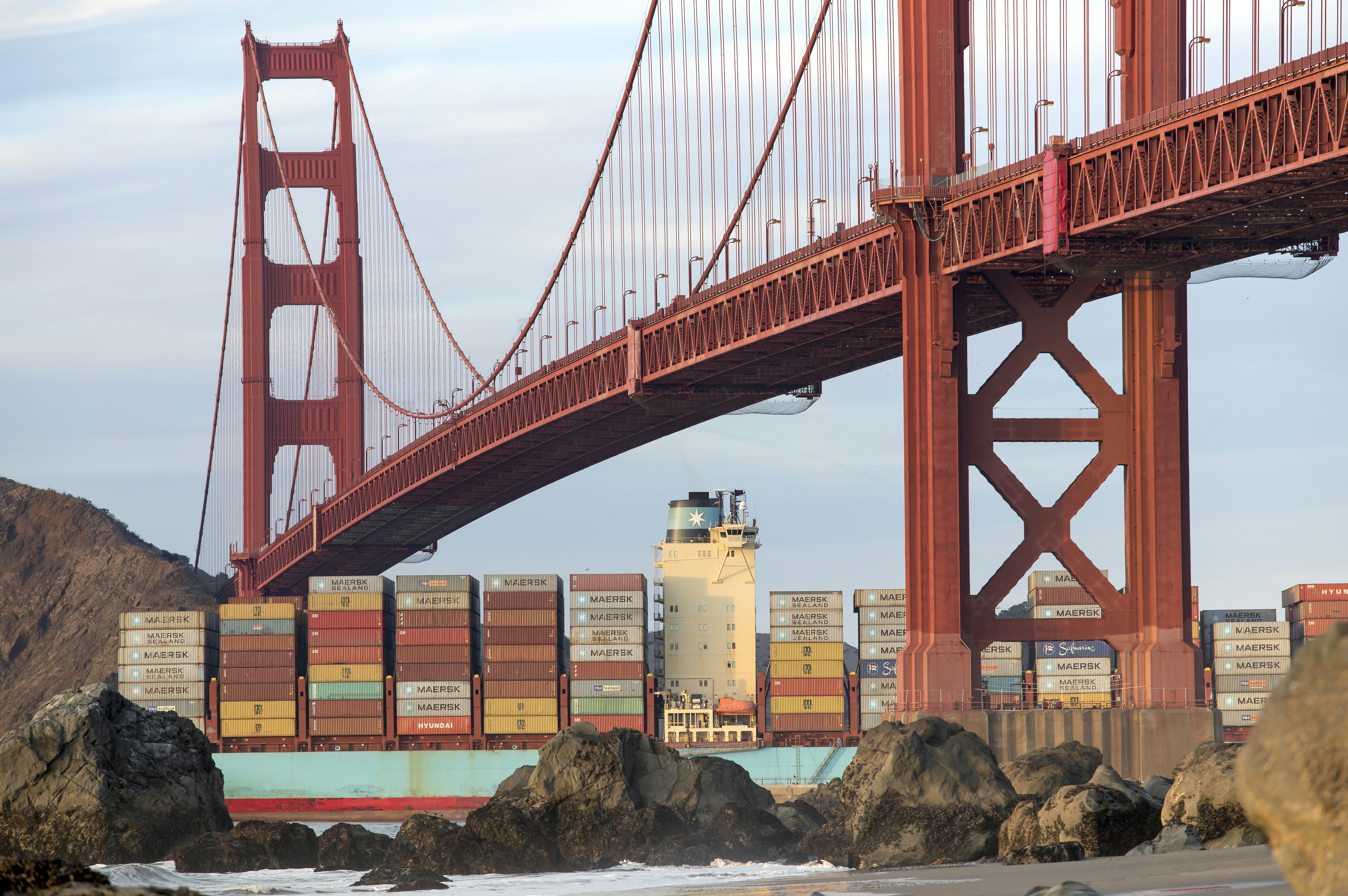 A large red bridge with containers photo – Free Building Image on Unsplash