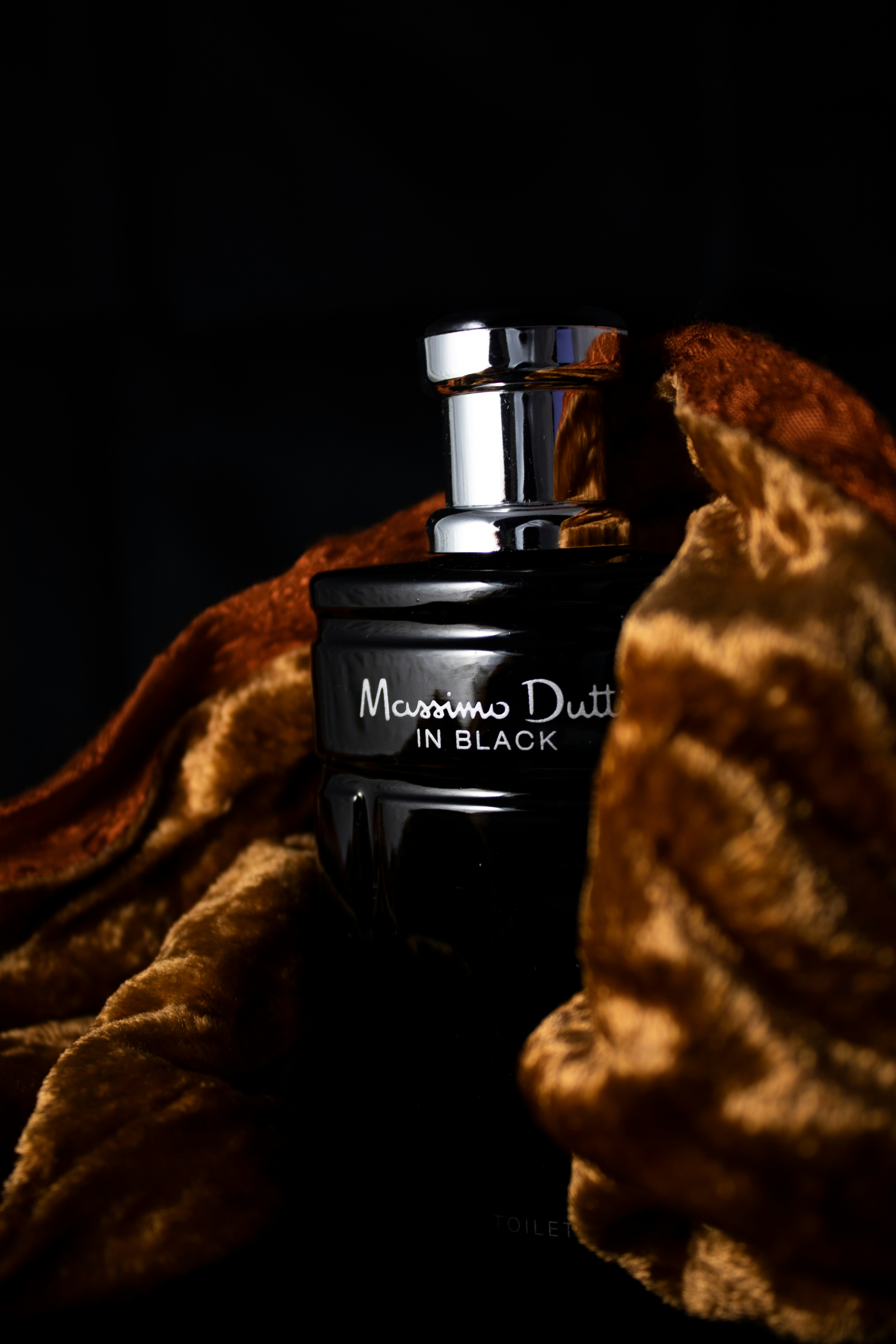A bottle of perfume with Jack Daniel's in the background photo – Free ...