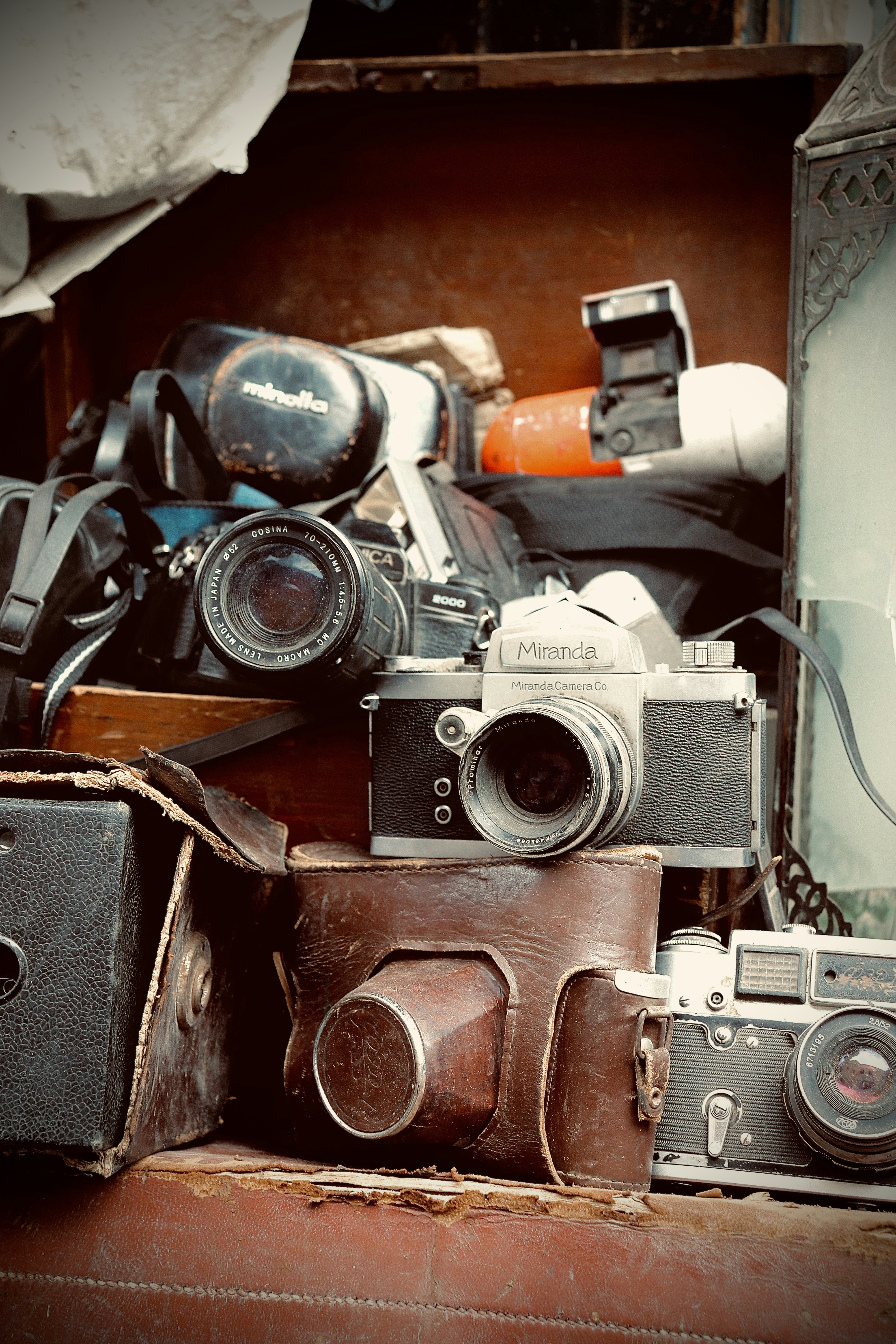 Miranda Among Forgotten Classics: A Quiet Stack of Vintage Cameras