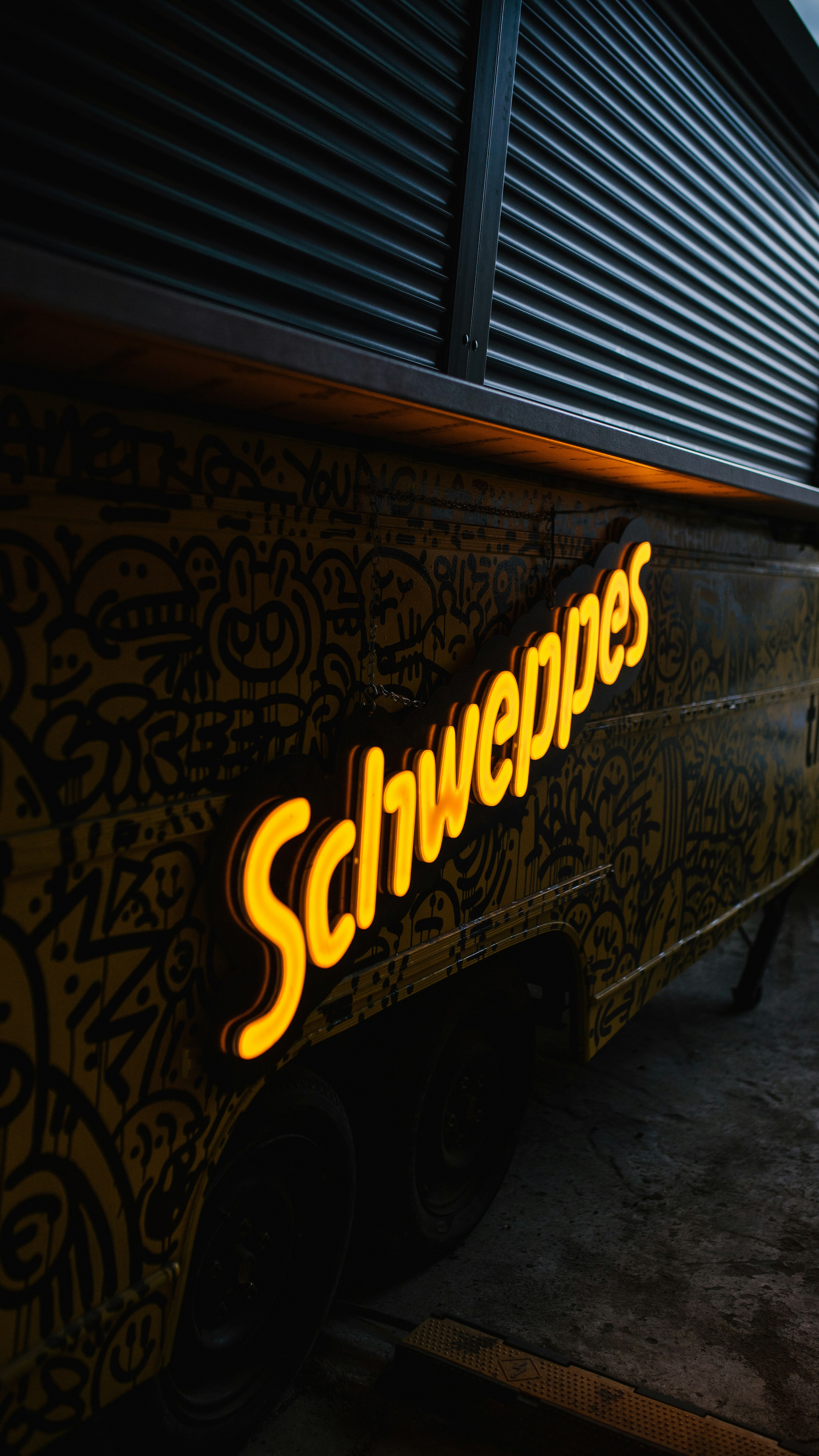 Neon Script on a Graffiti-draped Truck