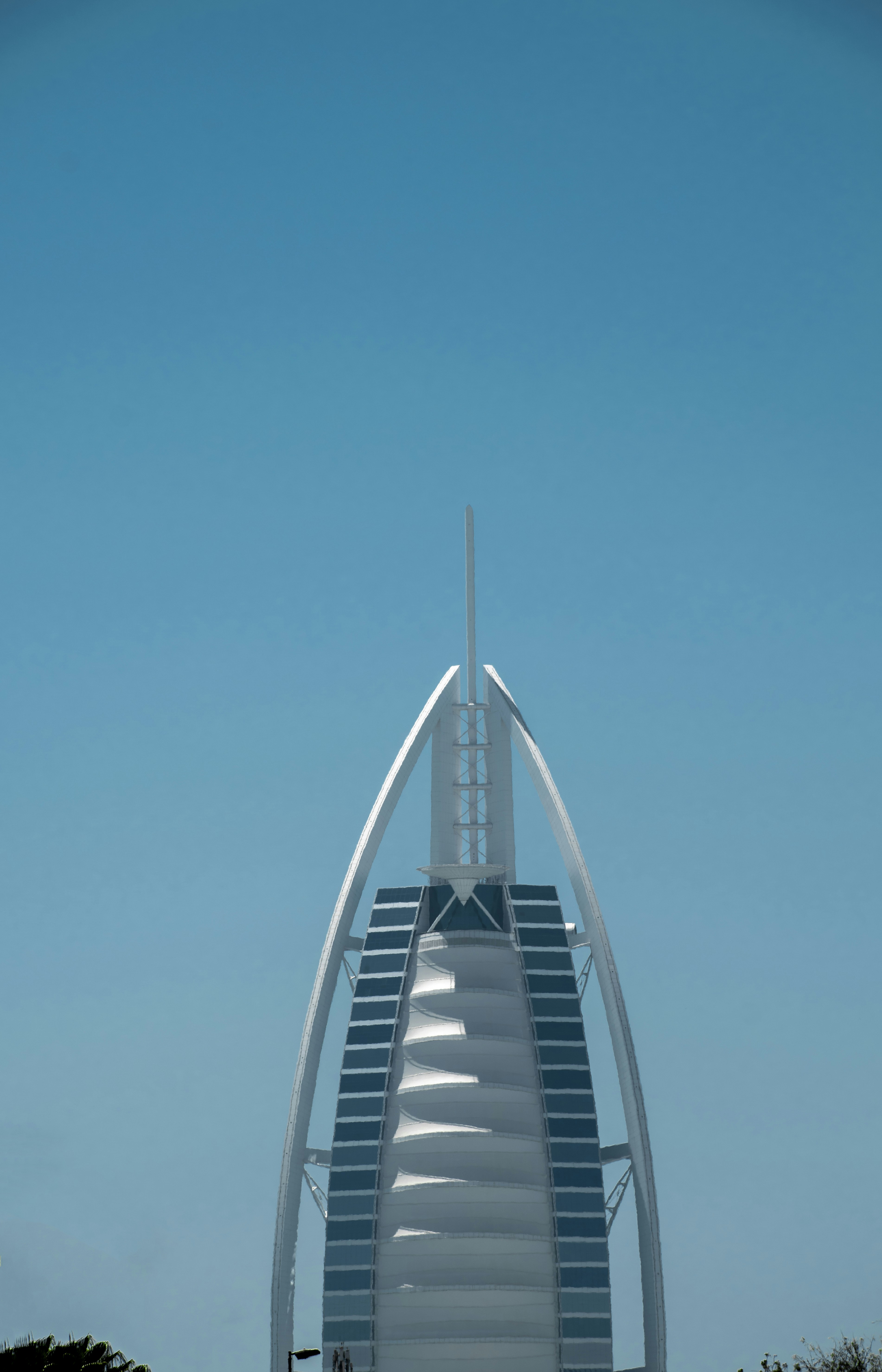 A tall building with a pointy top photo – Free Blue Image on Unsplash