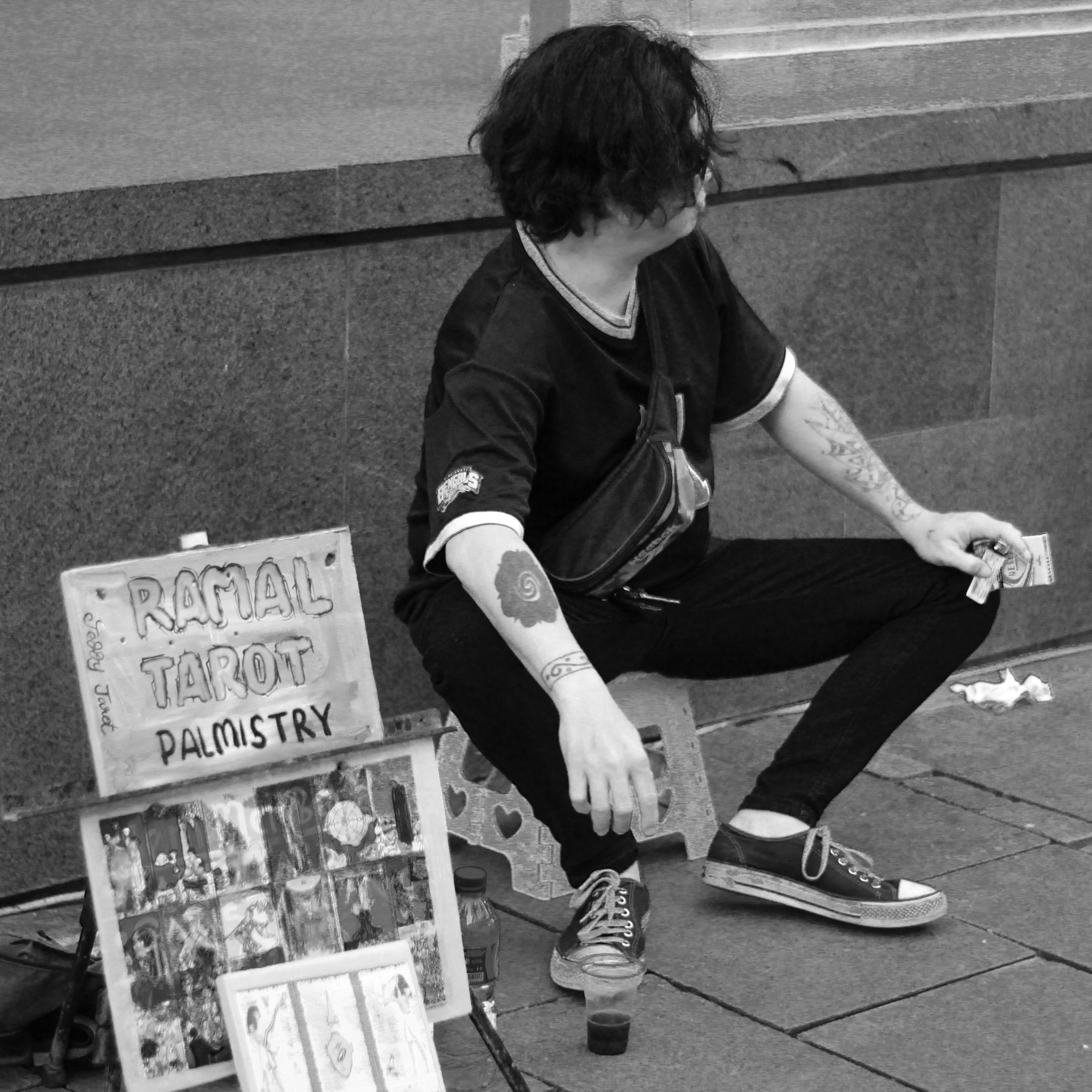 Curbside Palmistry: Inked Hands and Tarot by the Signboard
