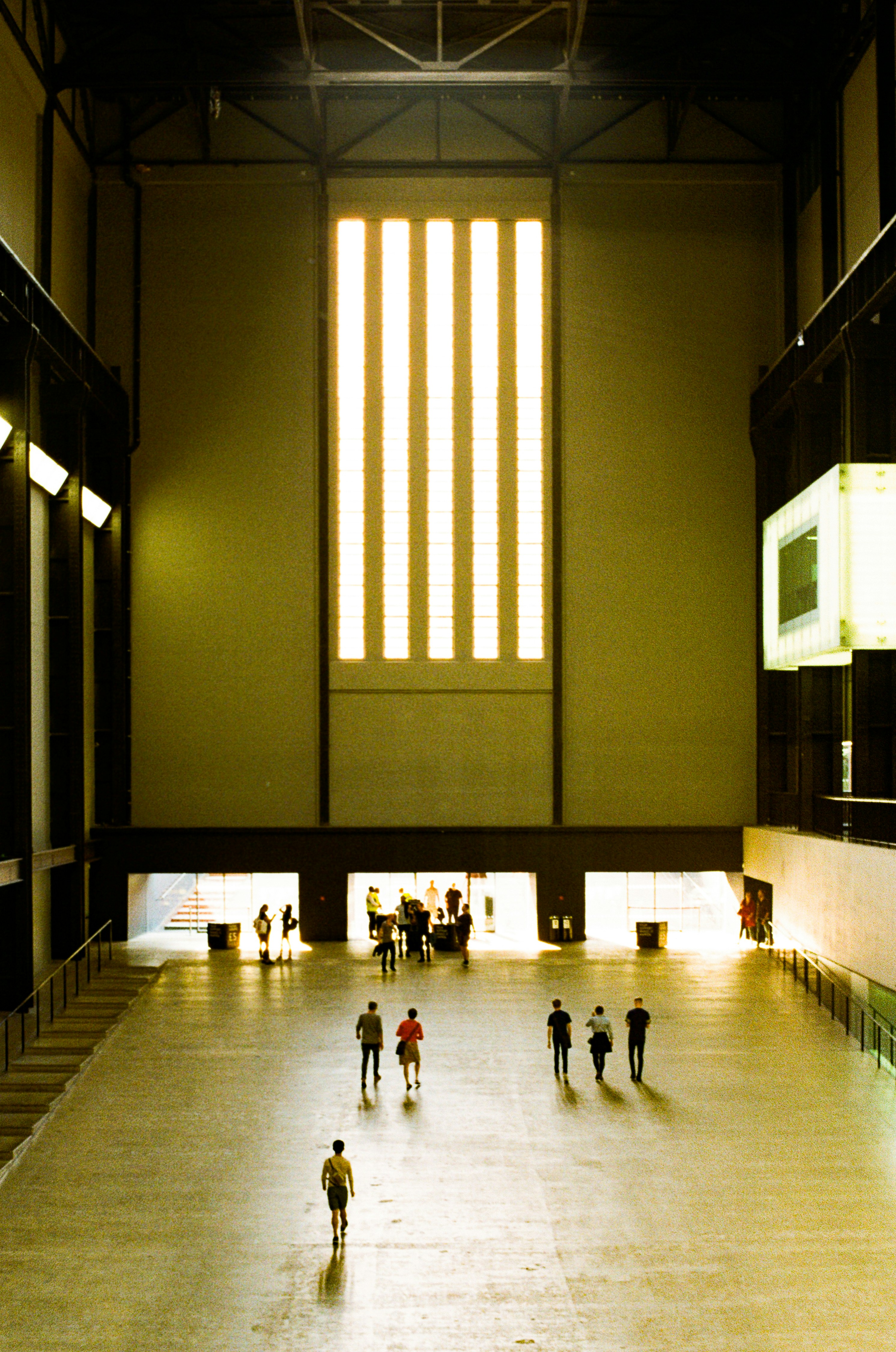 A group of people walking in a large building photo – Free Green Image ...