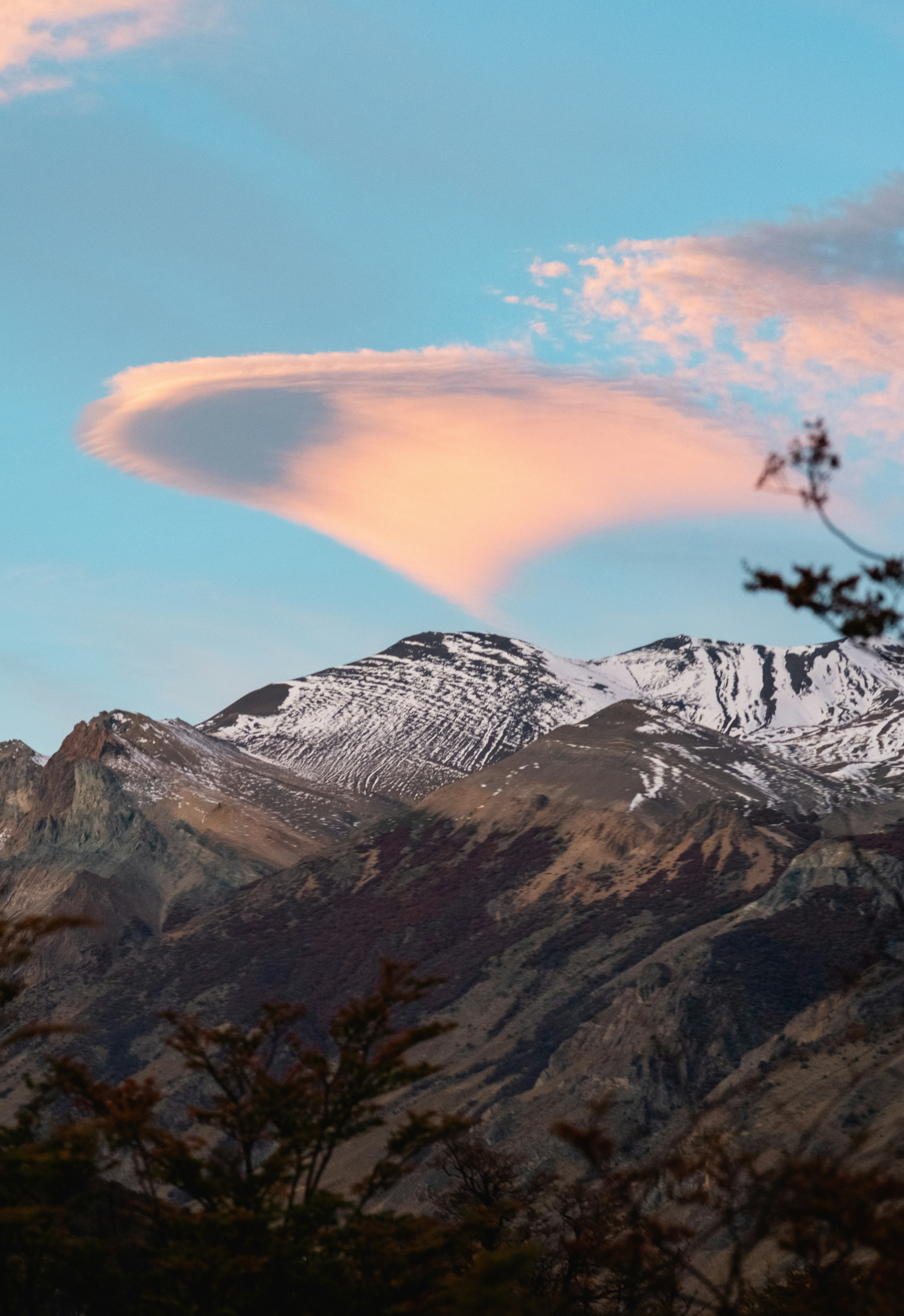 Pink Lenticular Cloud Crown Over Snow-veined Peaks at Twilight