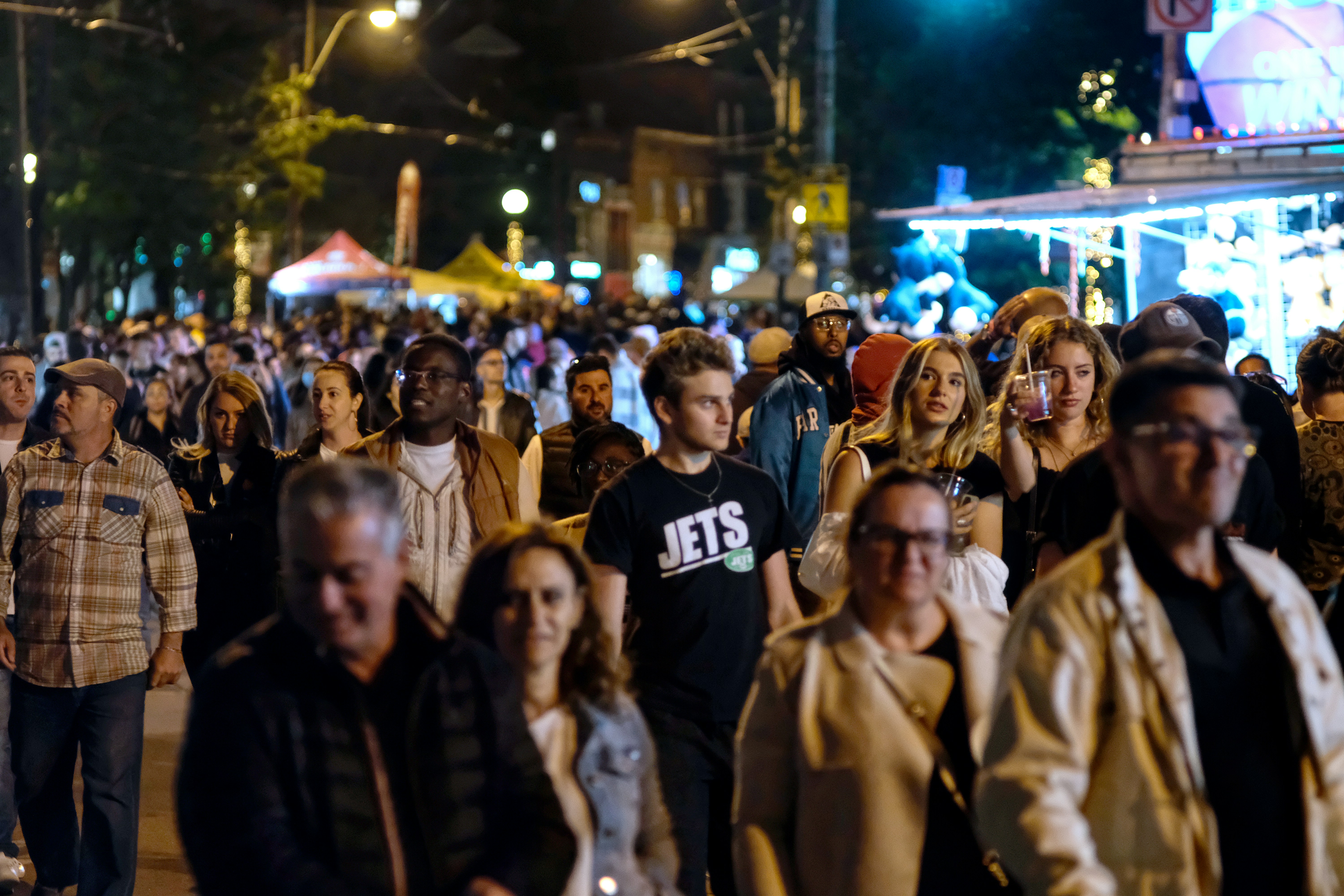 Night Market Street: A Crowd Clashes Light and Night