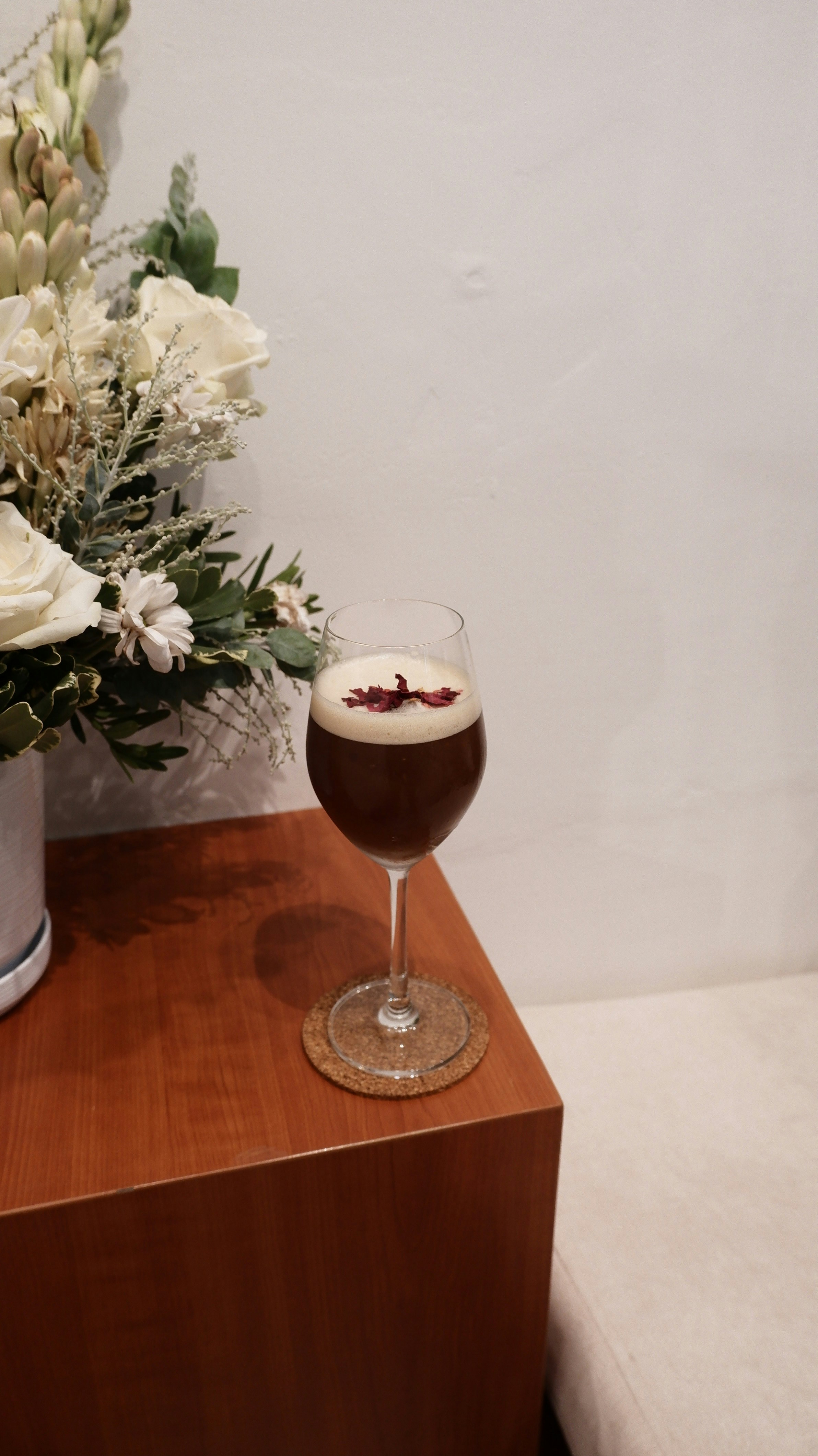 A glass of wine on a table photo – Free Beverage Image on Unsplash