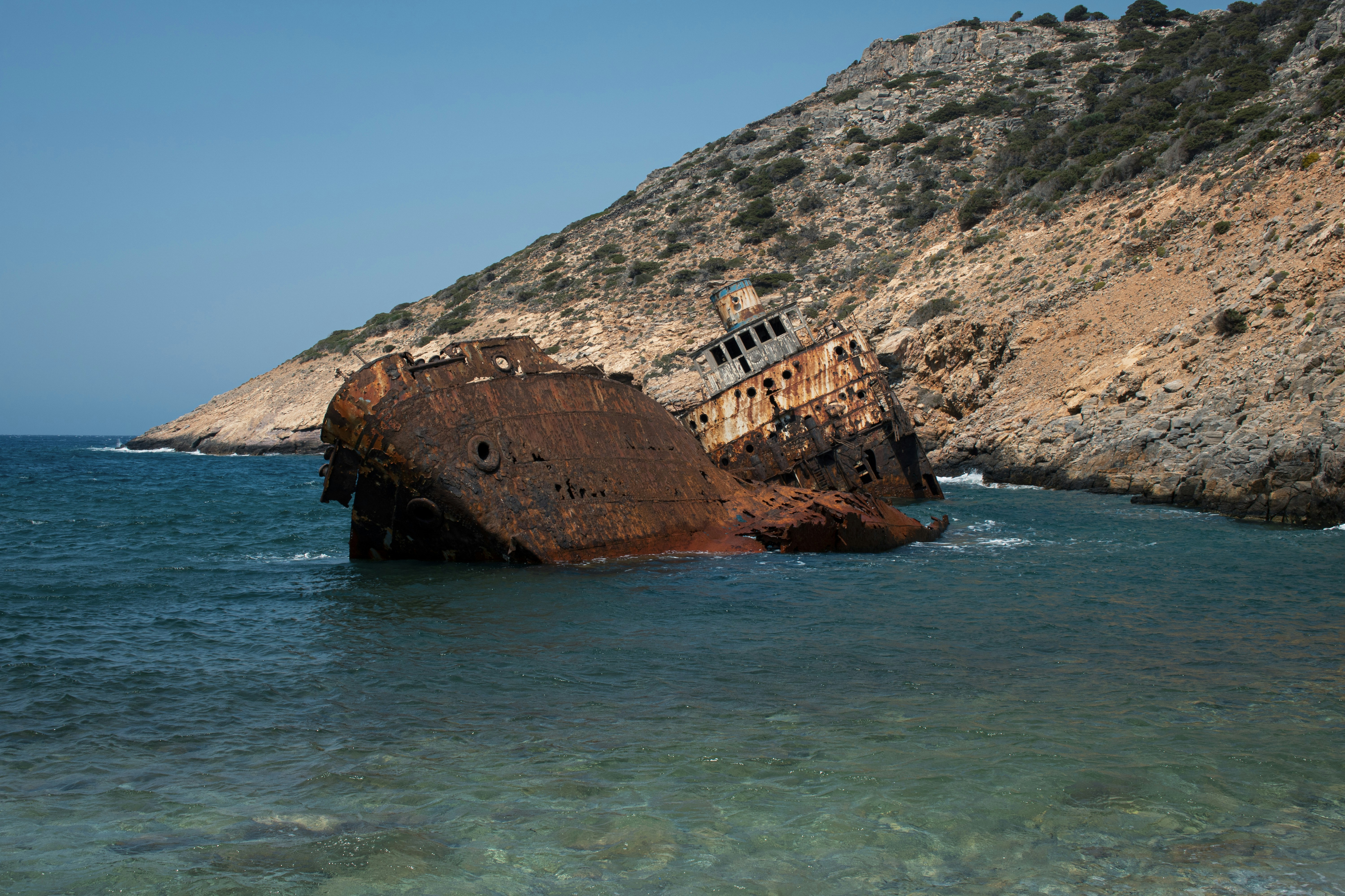 Emerald Cove Rust: a shipwreck wedged against a cliffy shoreline