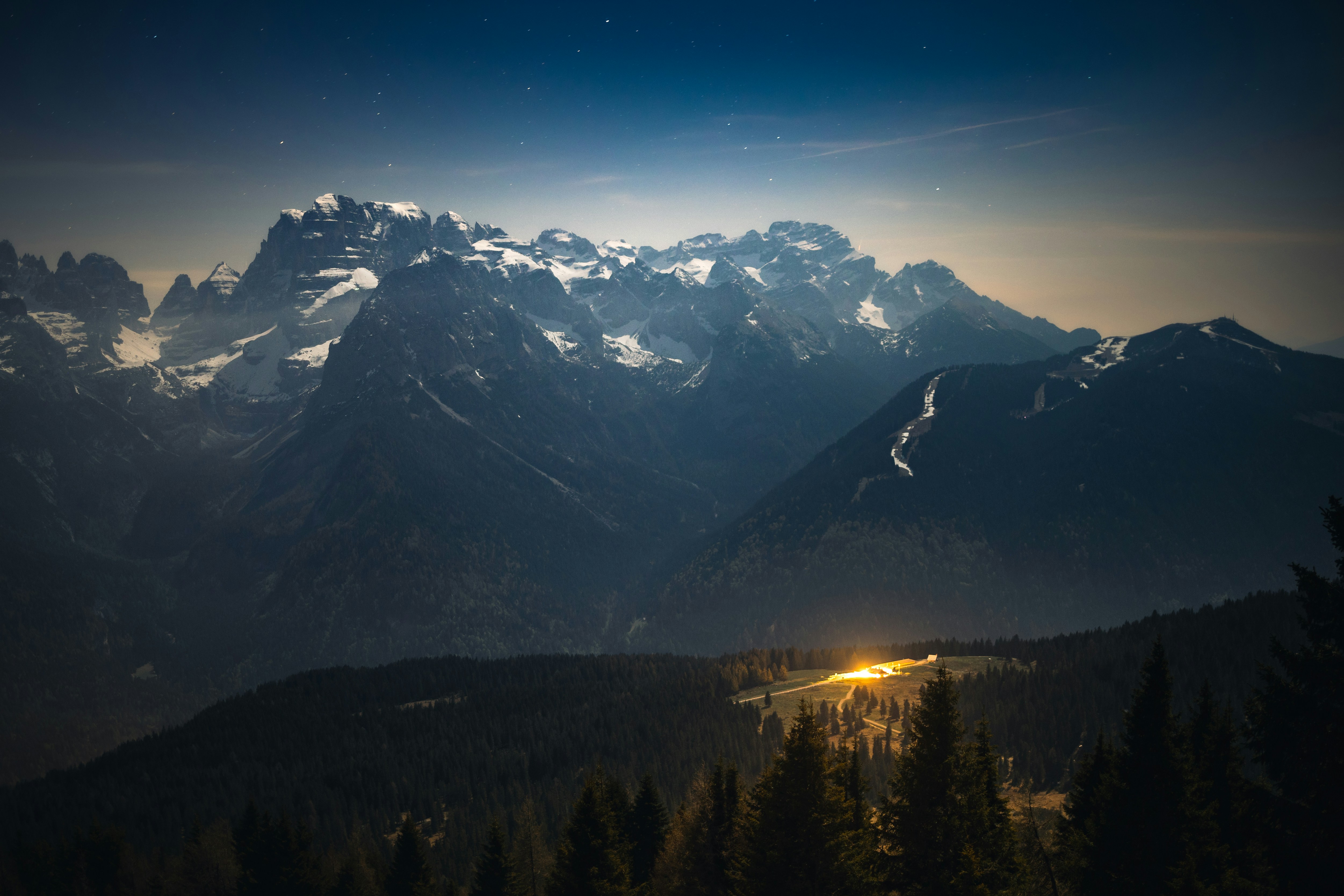 Lantern on the Ridge: Night Trail Through Snowbound Peaks